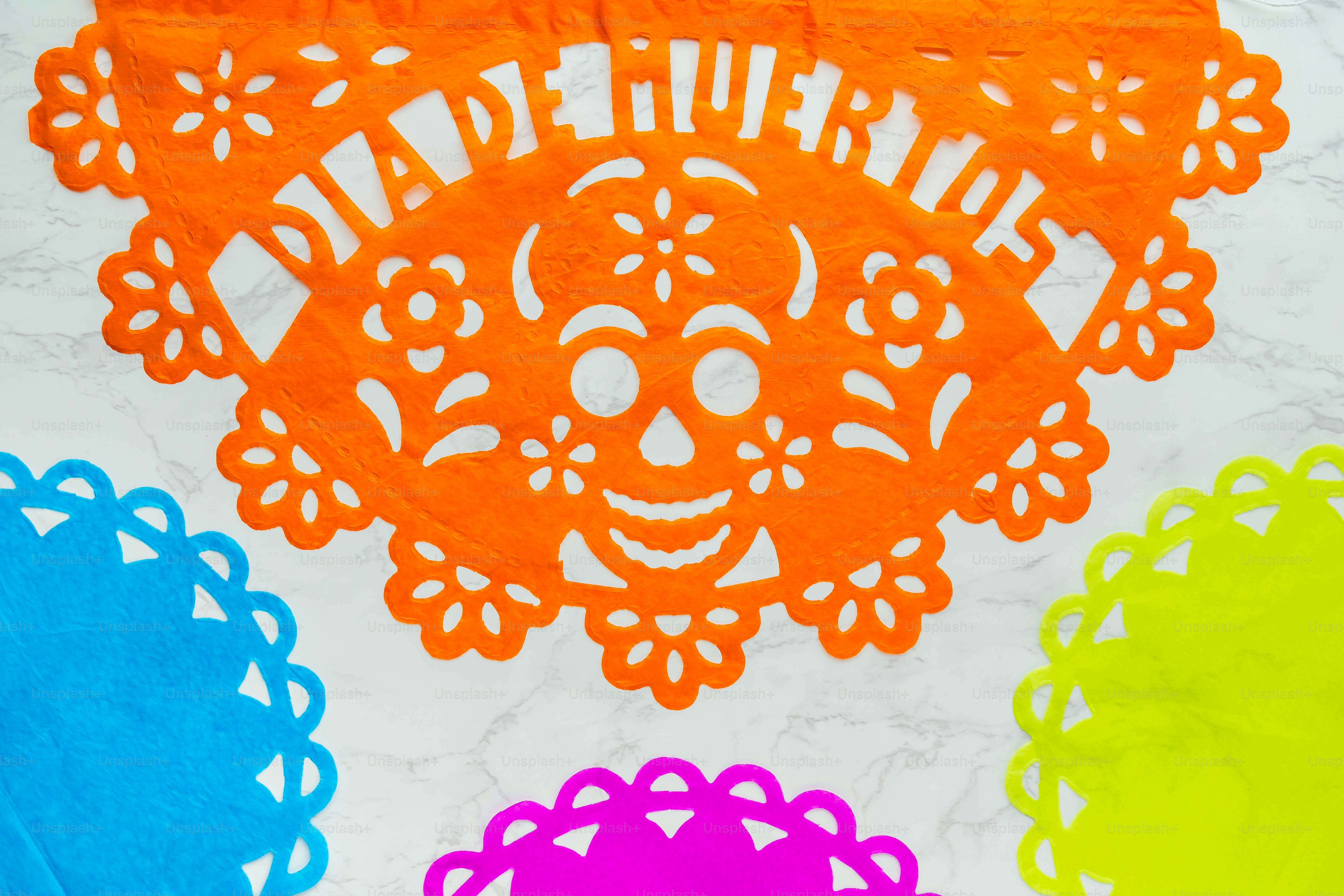 A group of different colored paper cut outs photo – Mexico Image on ...