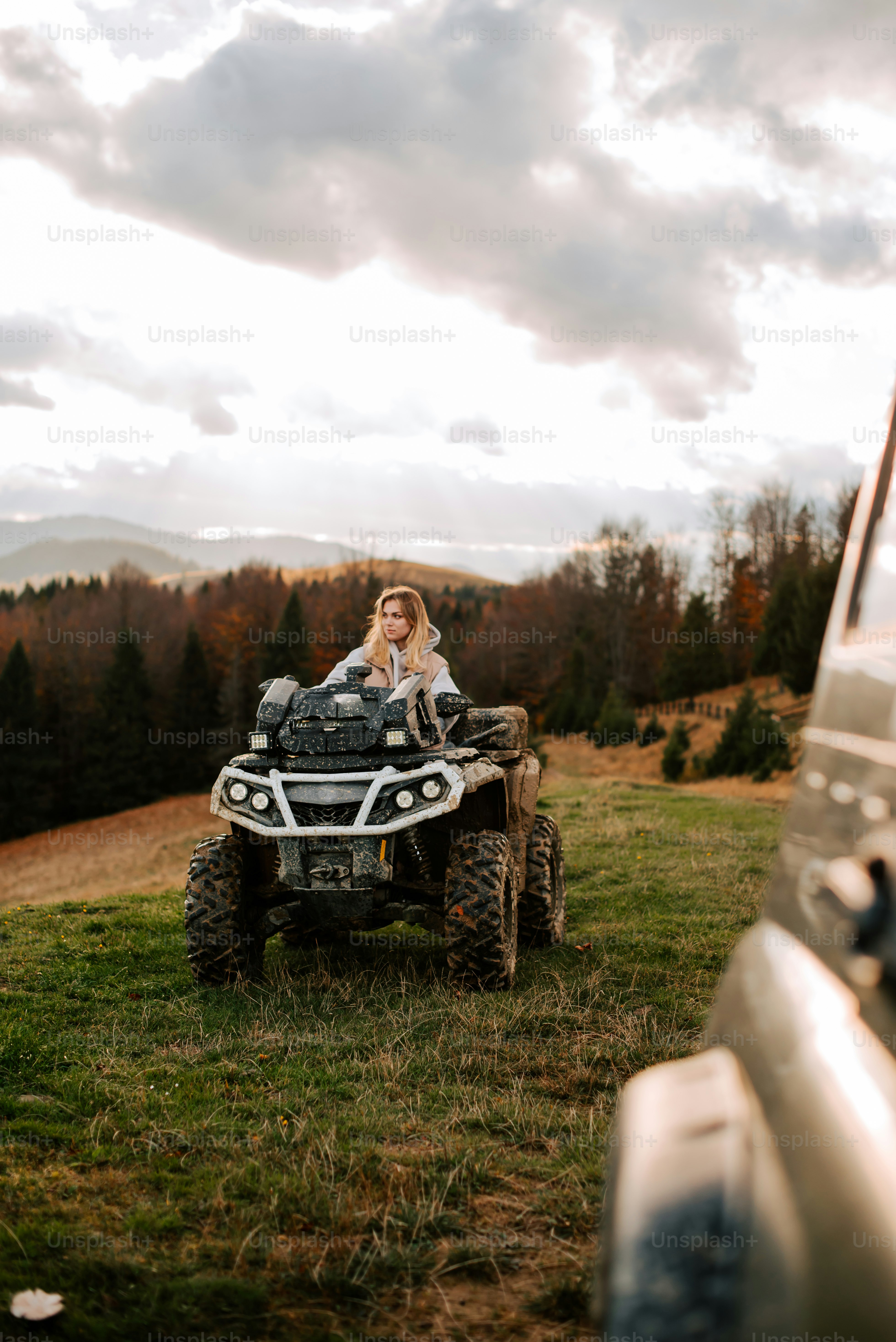 A woman riding on the back of a four wheeler photo – Adventure Image on ...