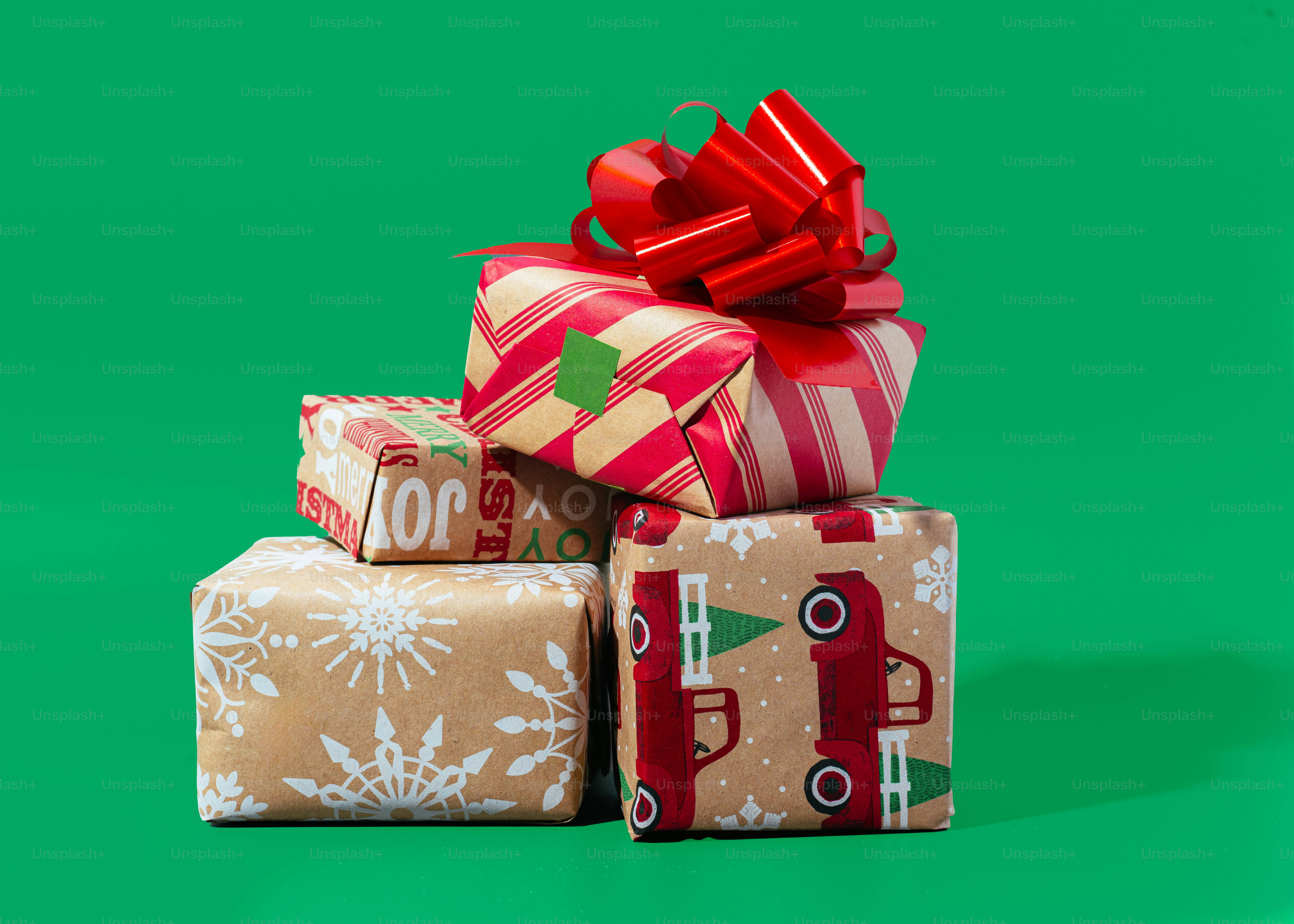 A stack of wrapped presents sitting on top of each other photo – Gift ...