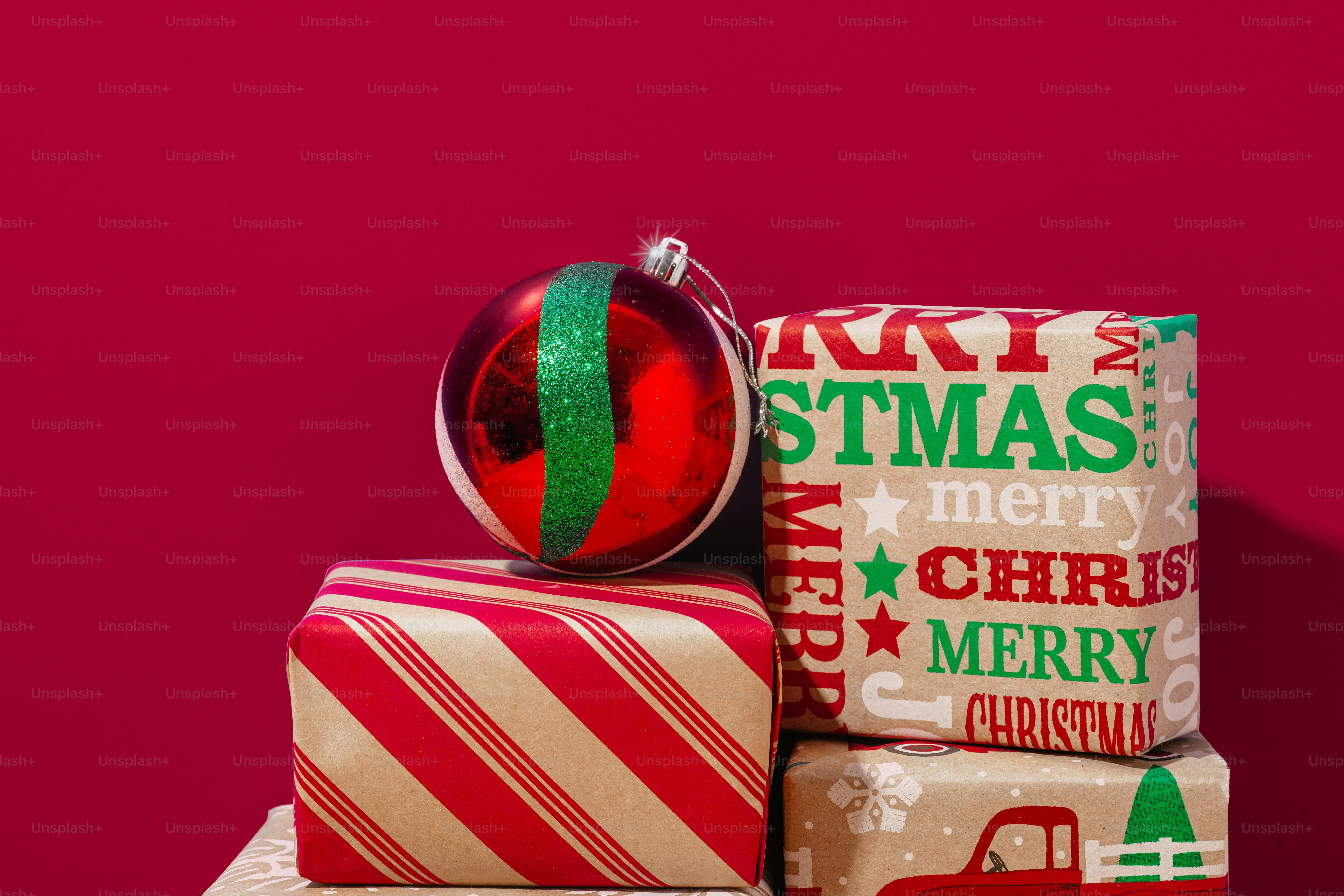 A stack of wrapped presents sitting on top of each other photo ...