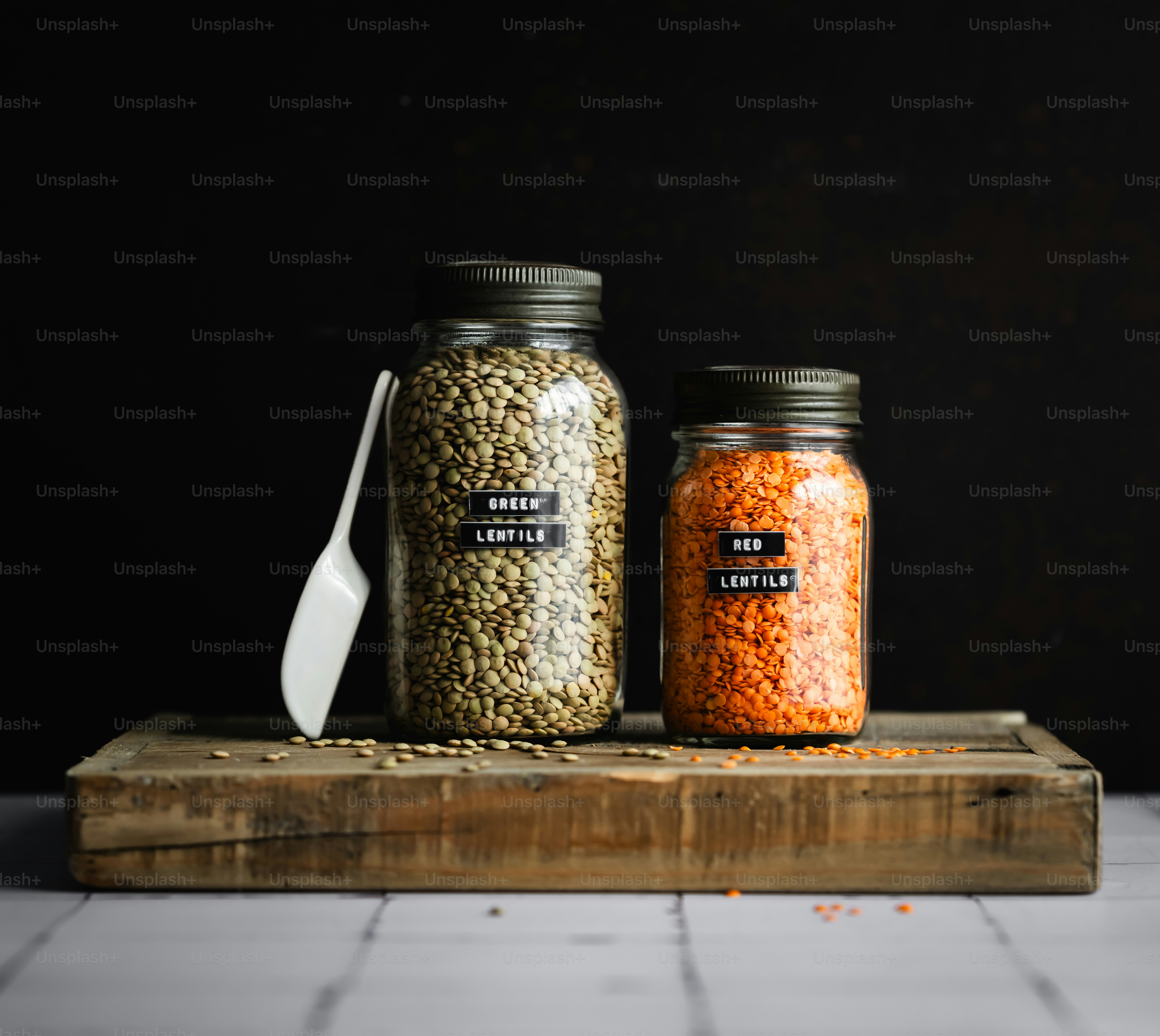 Two jars of food sit on a cutting board photo – Food Image on Unsplash