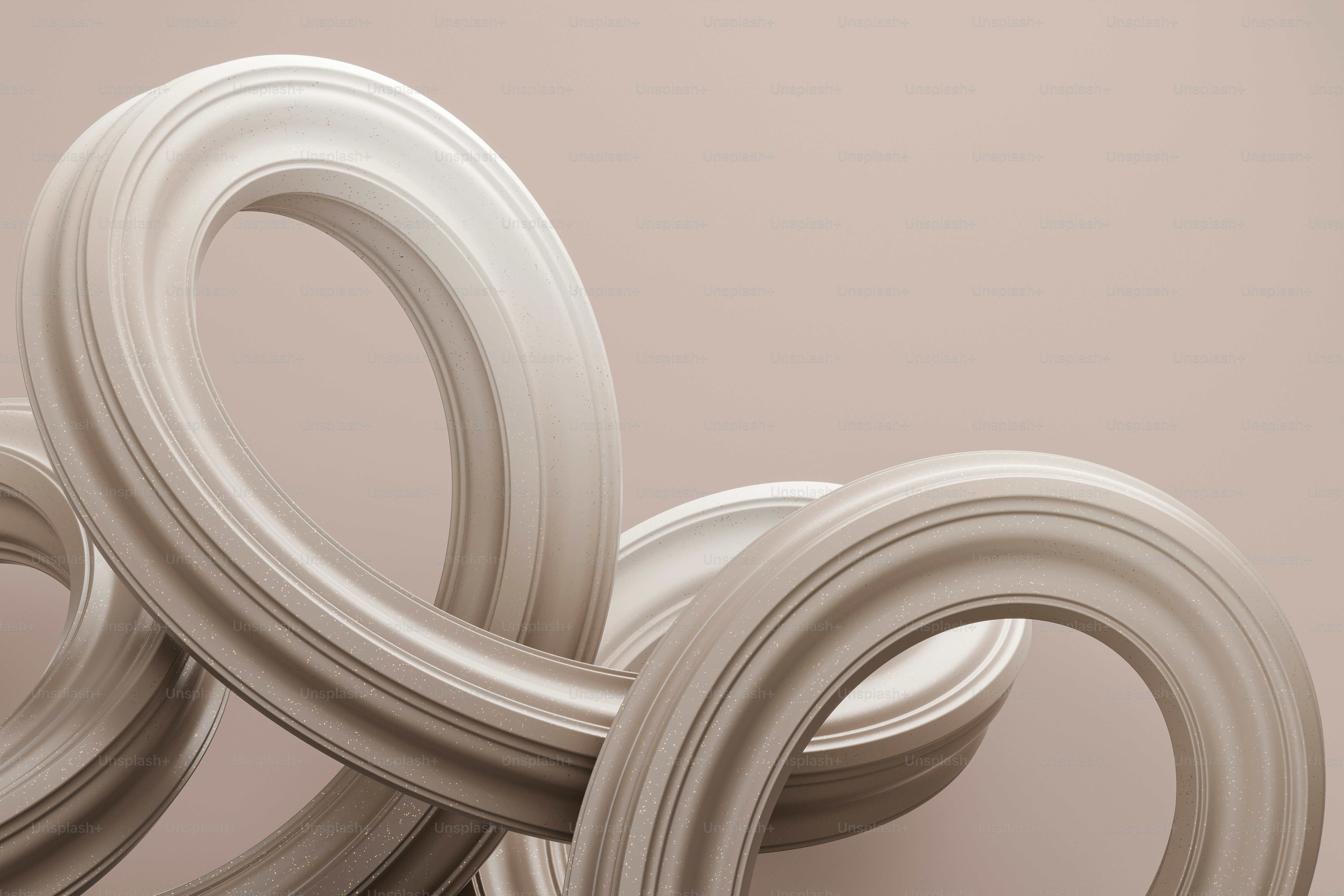 A group of white circular objects on a pink background photo ...