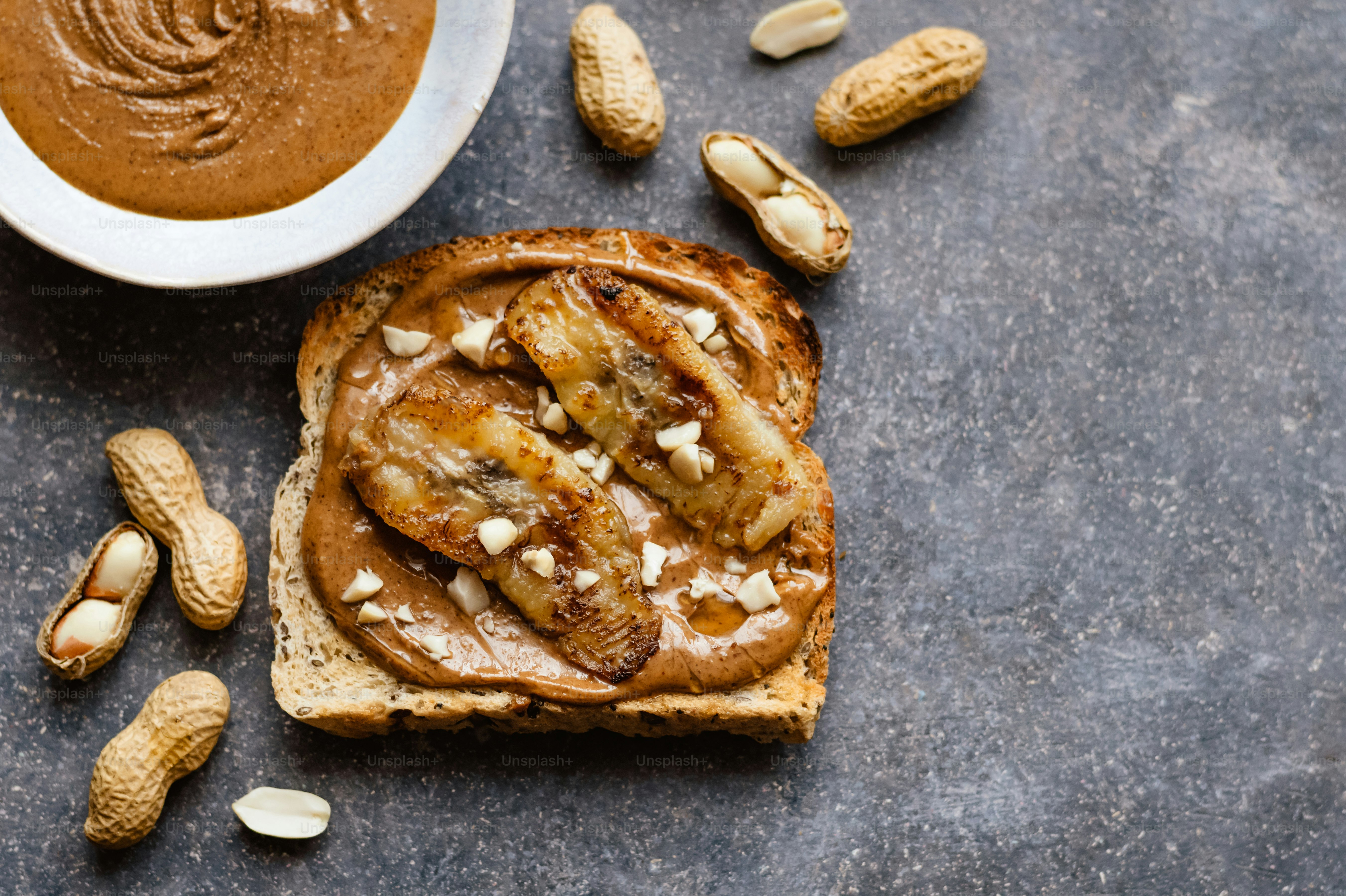 A peanut butter and banana sandwich with peanut butter photo – Peanuts ...