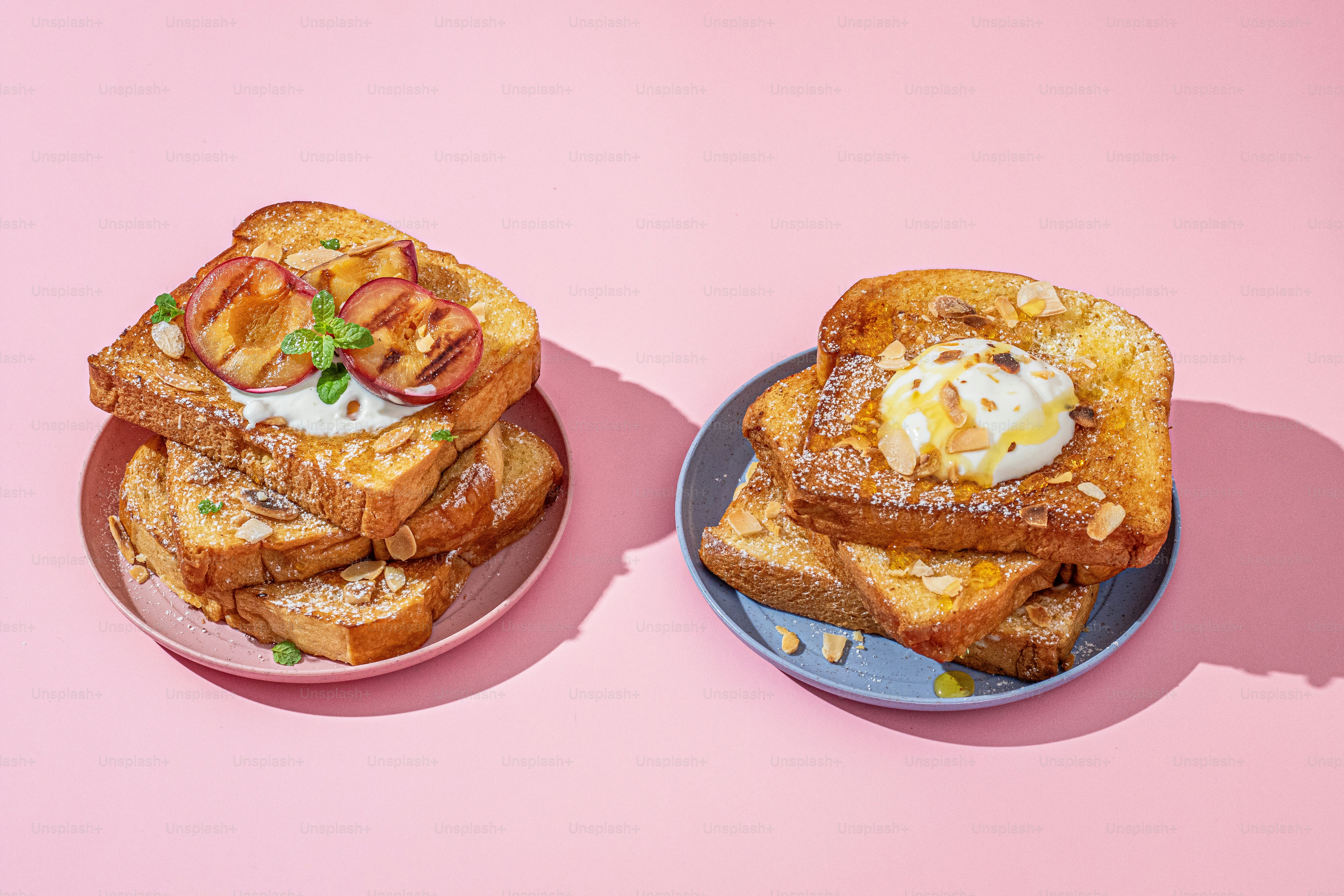 A couple of plates that have some food on them photo – Food Image on ...