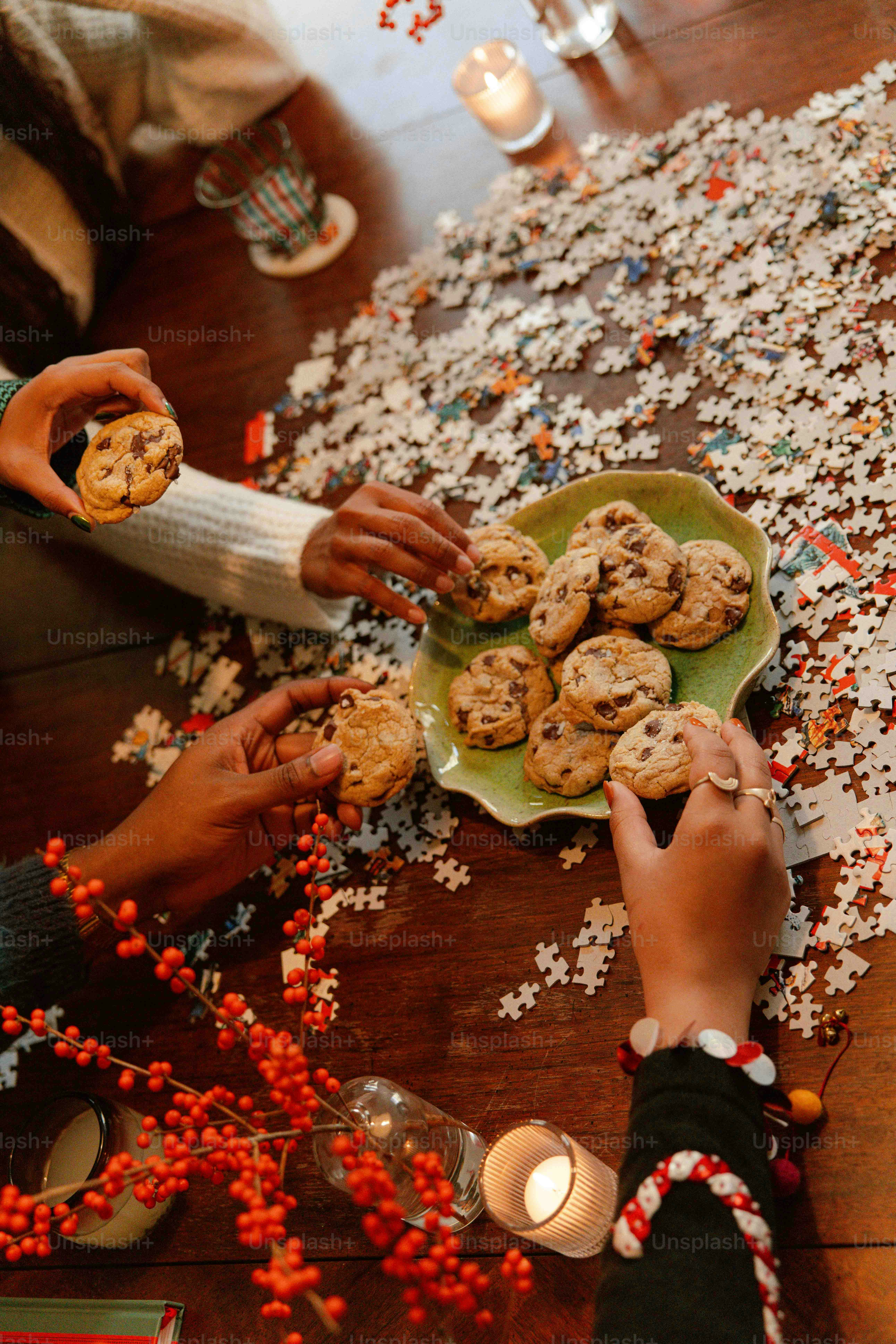 A couple of people that are eating some cookies photo – Christmas ...