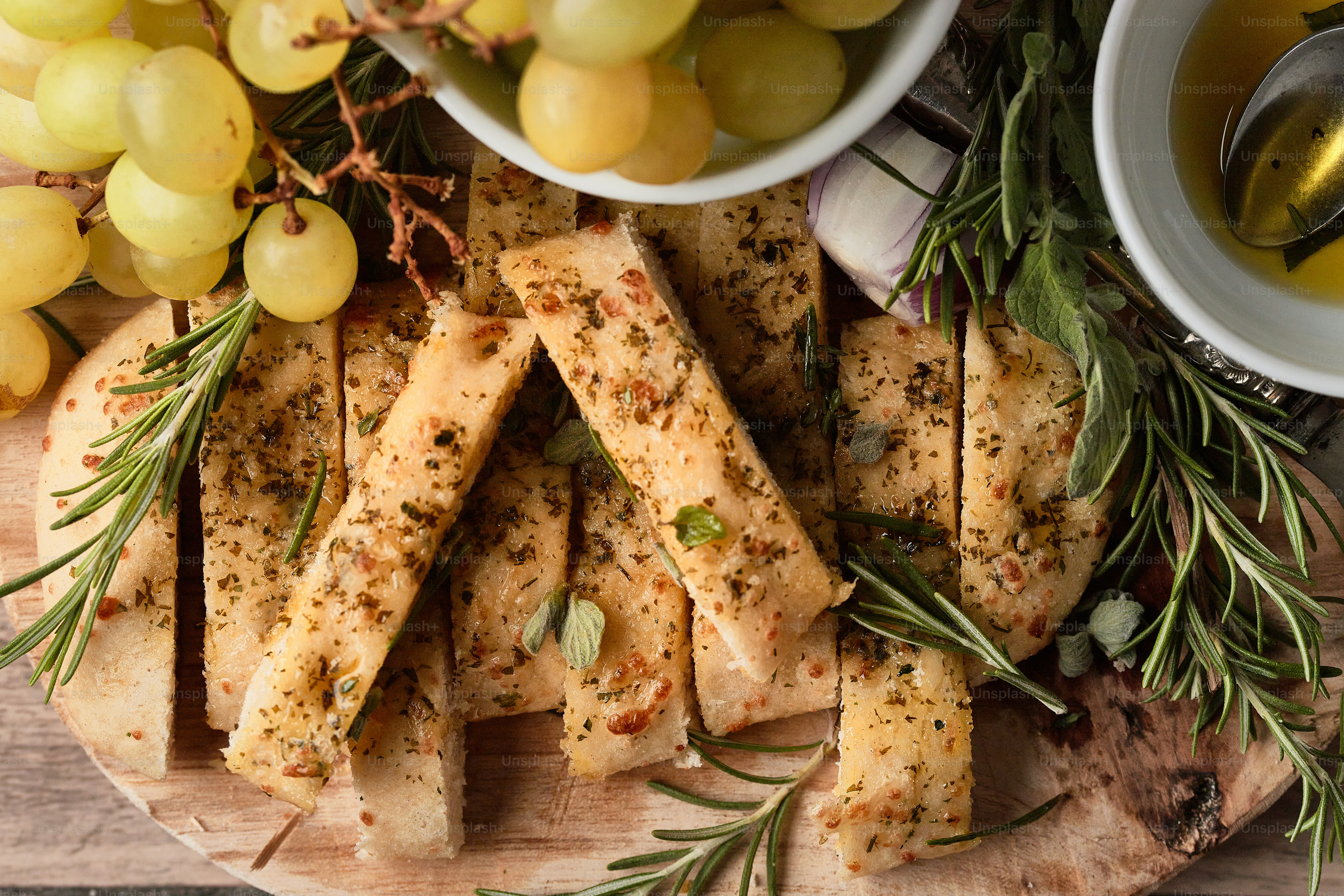 A platter of cheese sticks, grapes, and olives photo – Food Image on ...