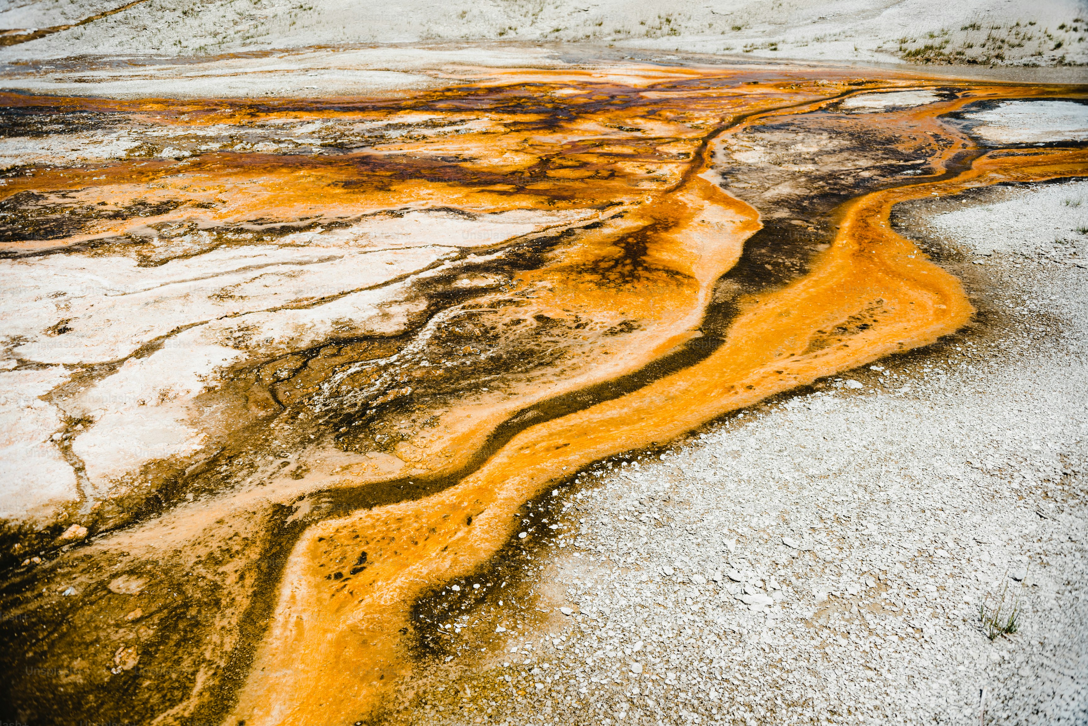 A view of the ground from above of a river photo – Yellowstone national ...