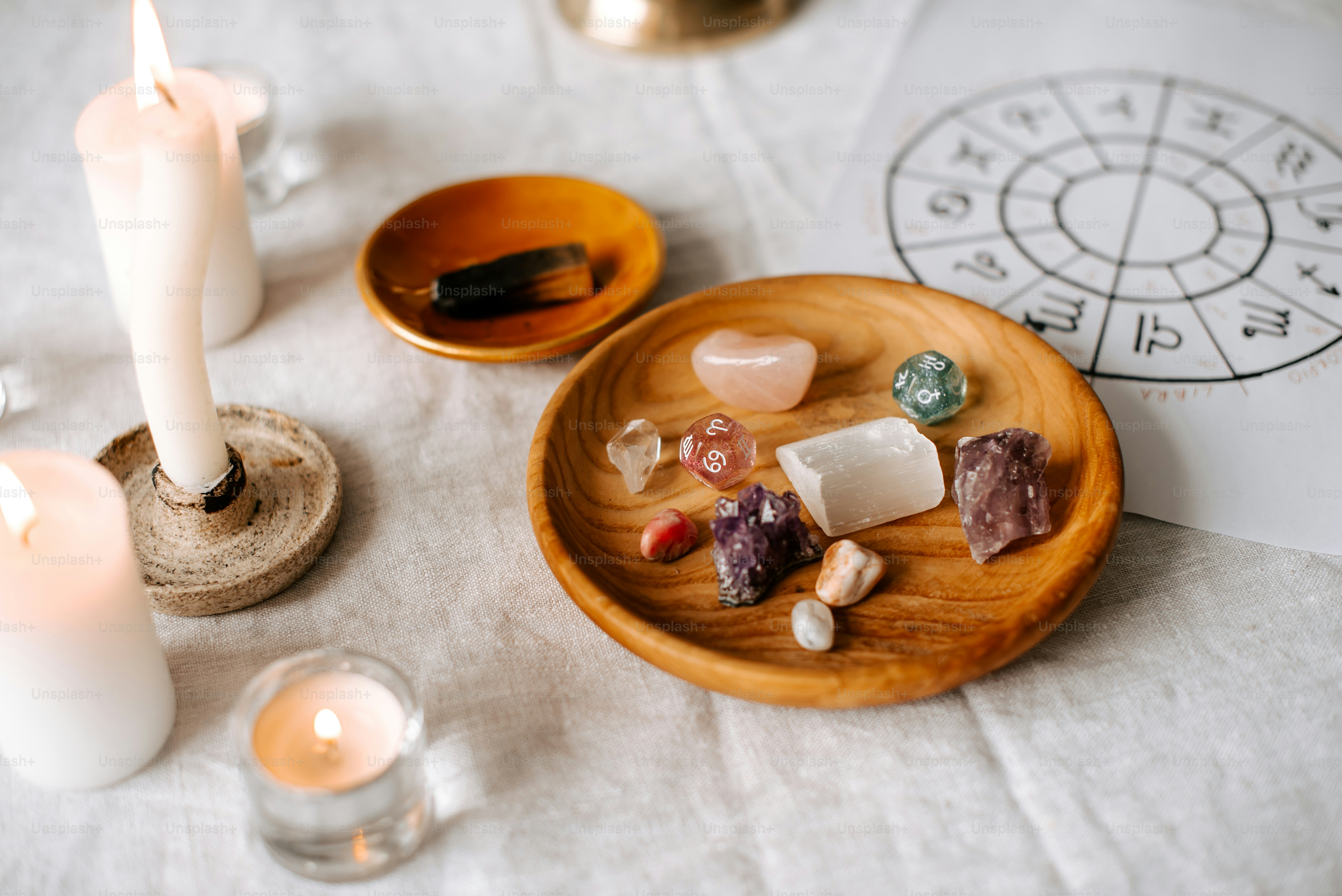 A wooden plate topped with lots of different types of rocks photo ...