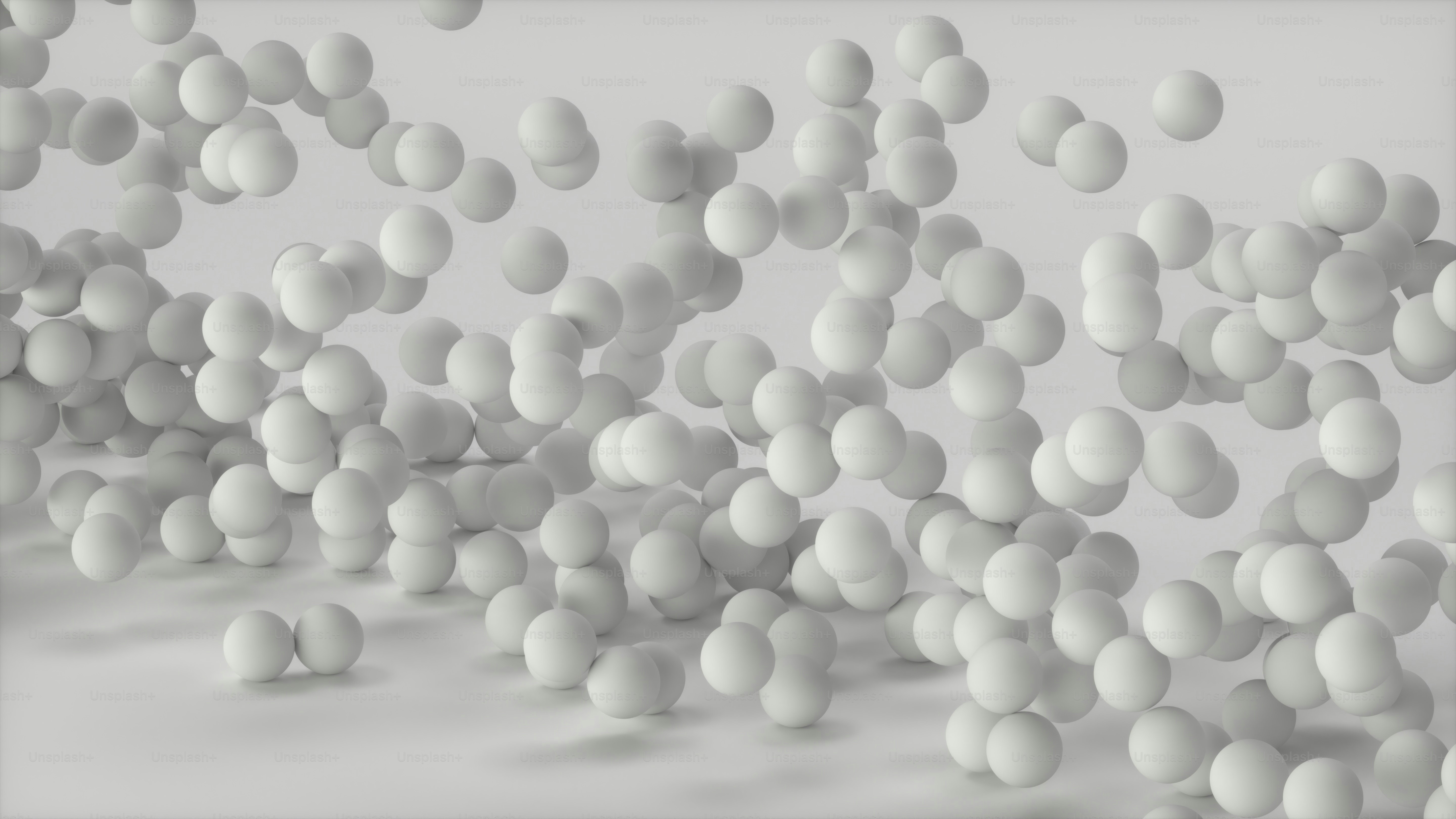 A group of white balls floating in the air photo – Background Image on ...