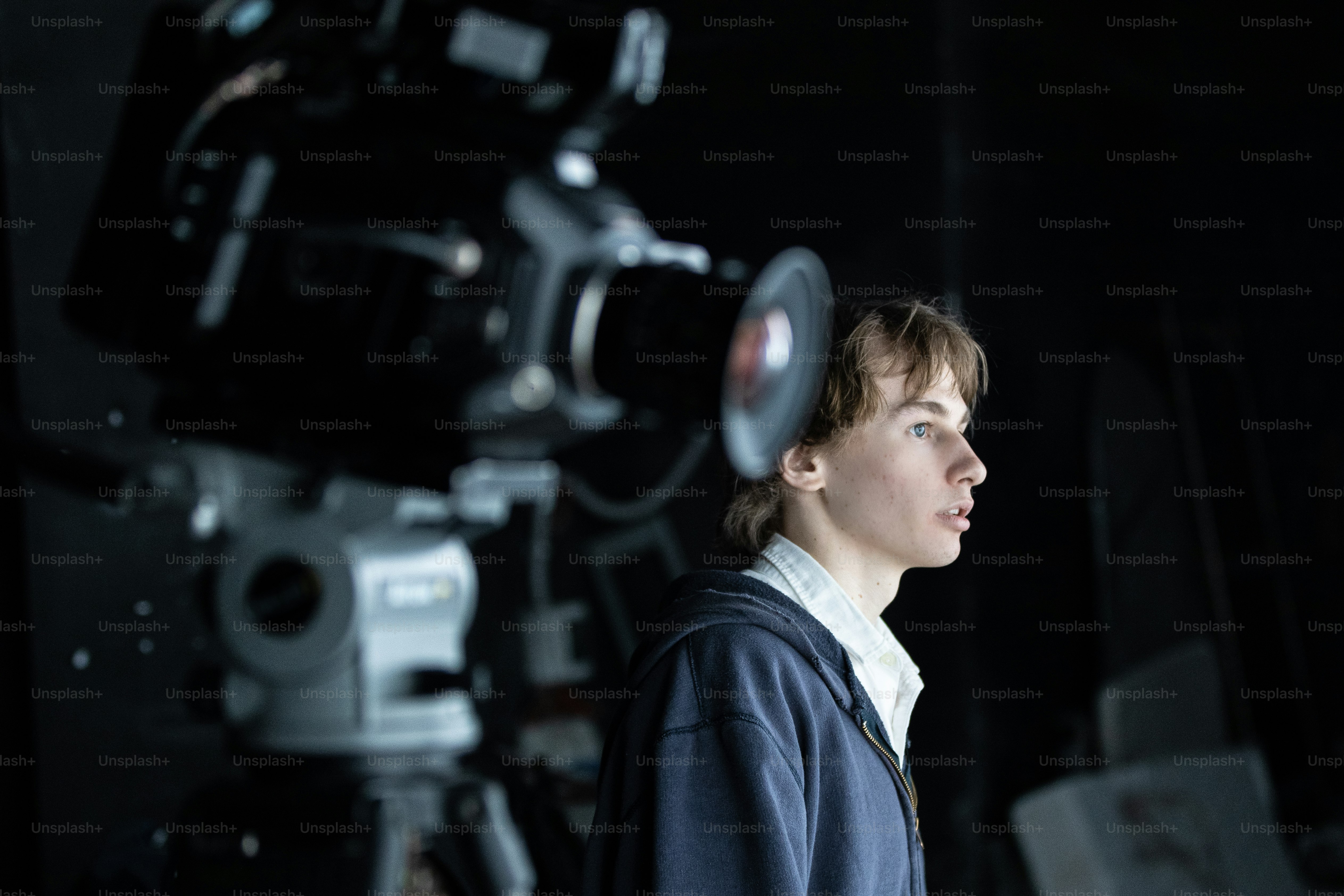 A person standing in front of a camera photo – Movie set Image on Unsplash
