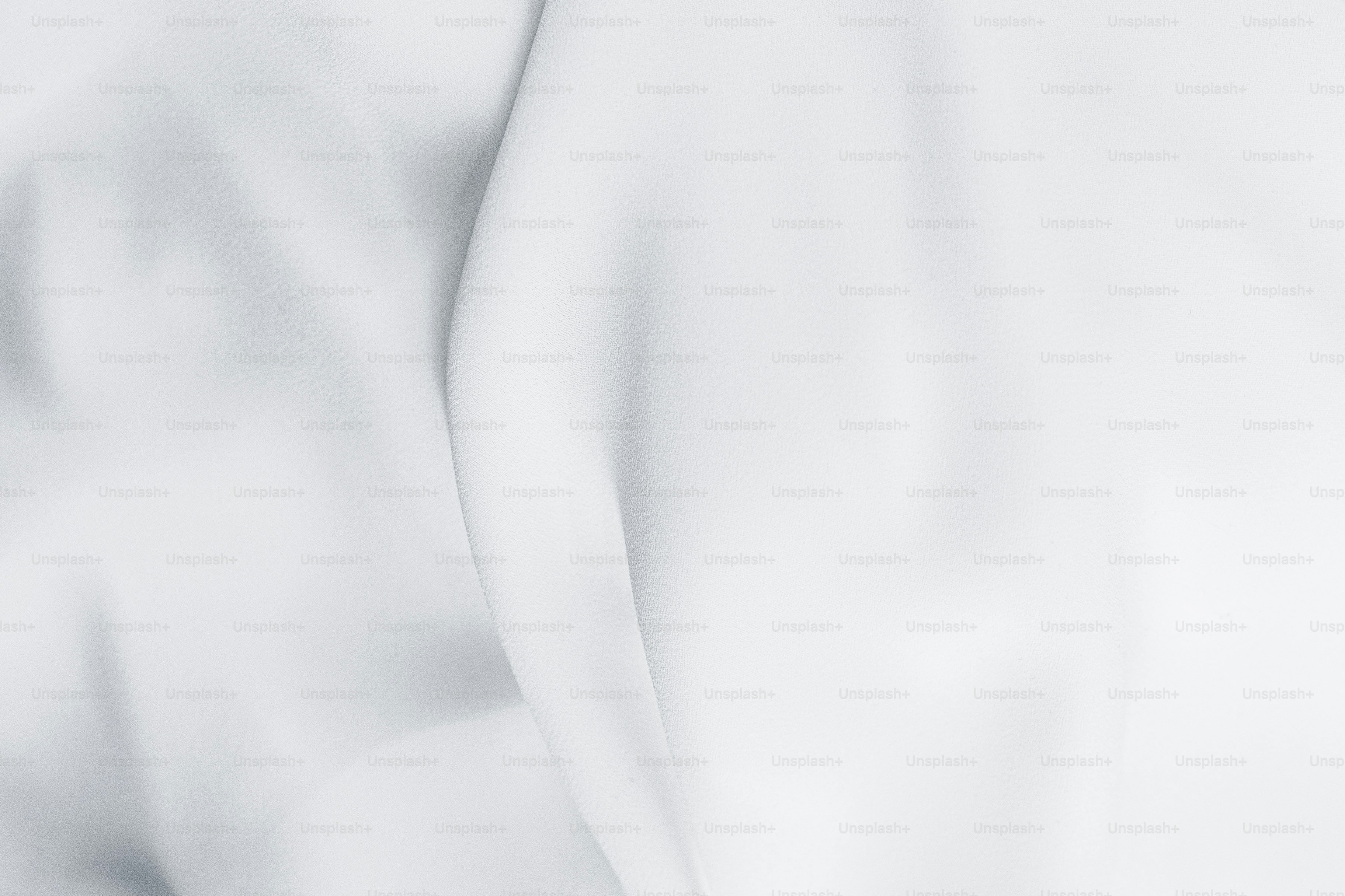 A close up of a white sheet with a white background photo – Background ...