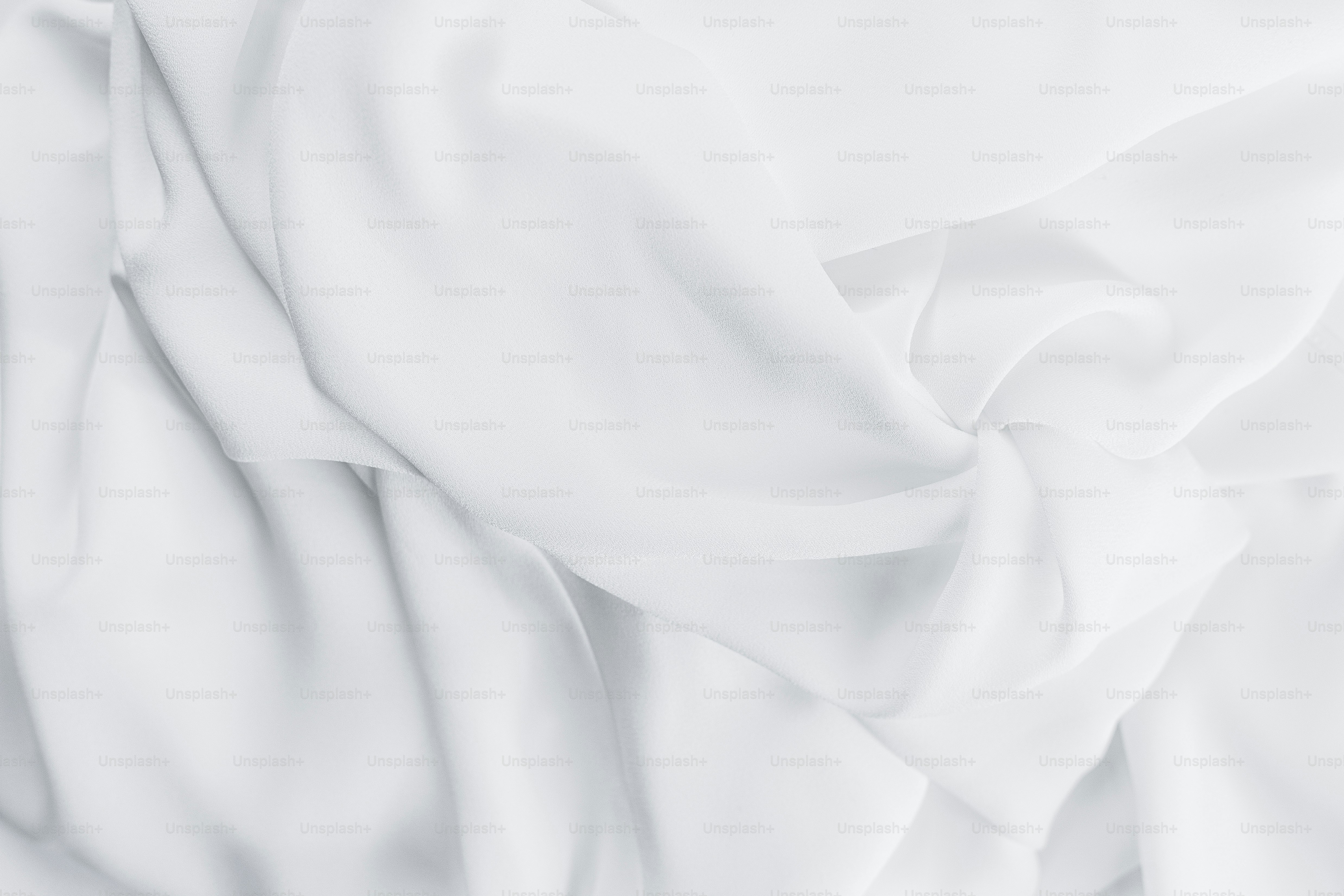 A close up of a white sheet on a bed photo – Wallpaper Image on Unsplash