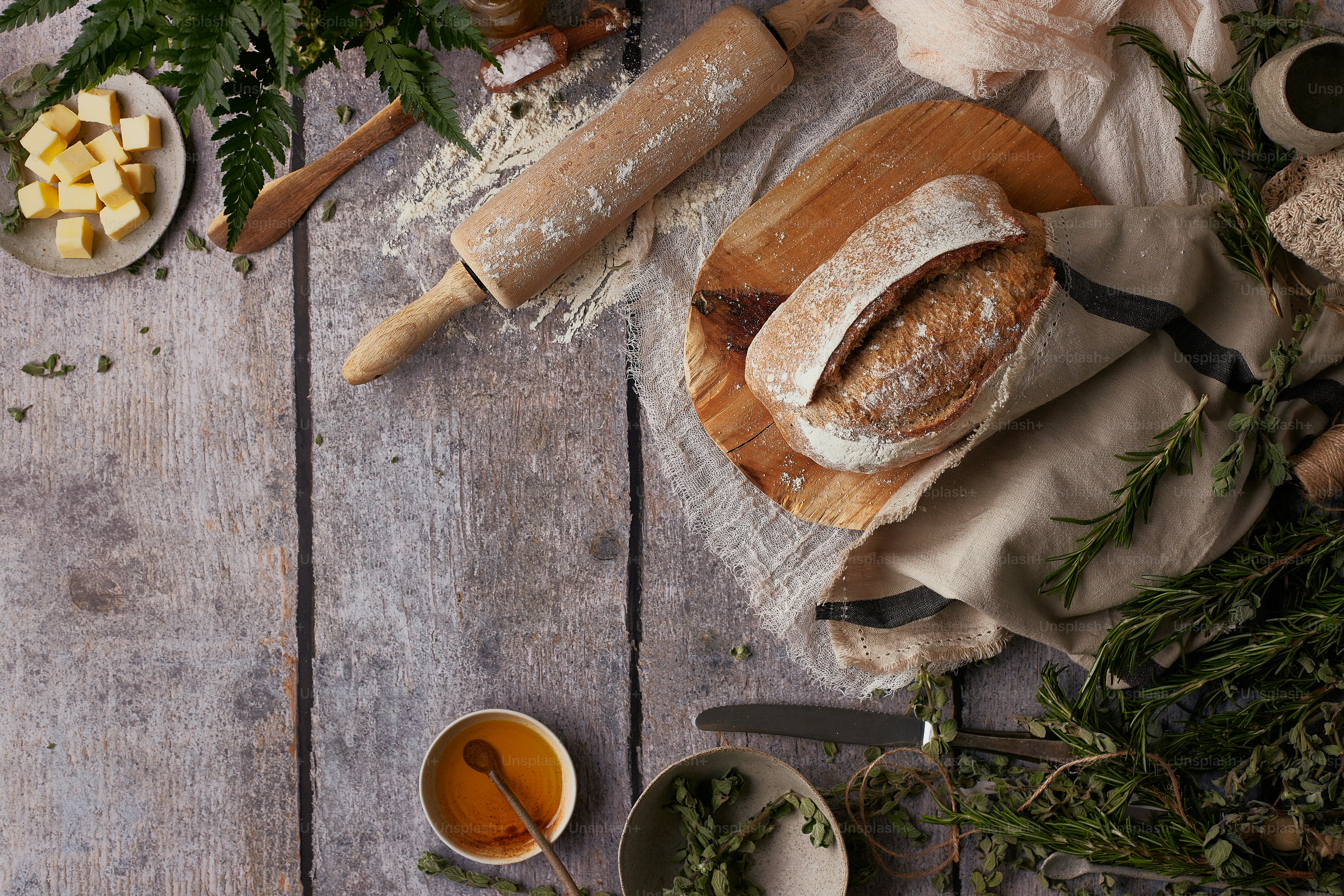 A wooden table topped with bread and butter photo – Food Image on Unsplash