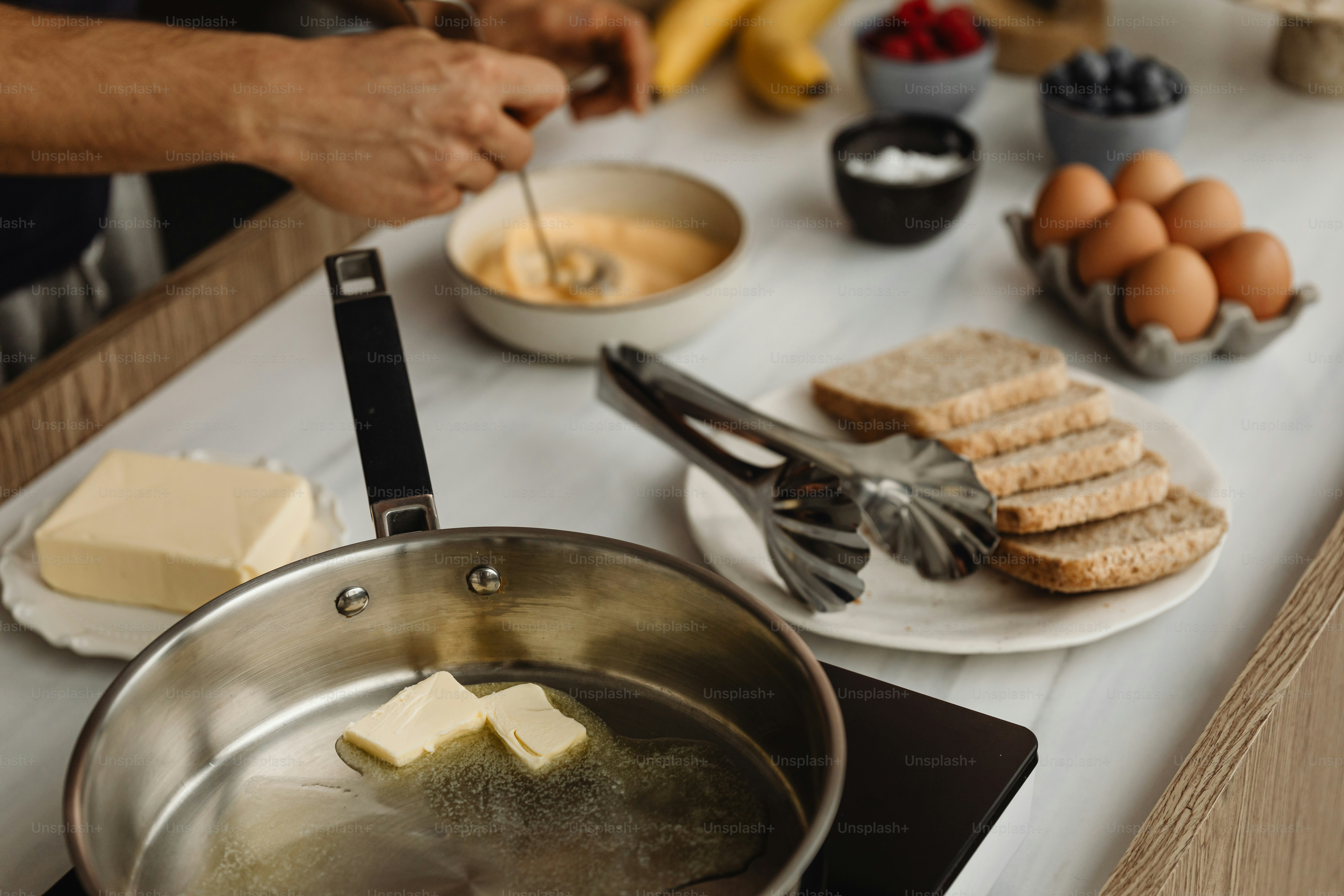 A person cooking food on a stove top photo – Food Image on Unsplash