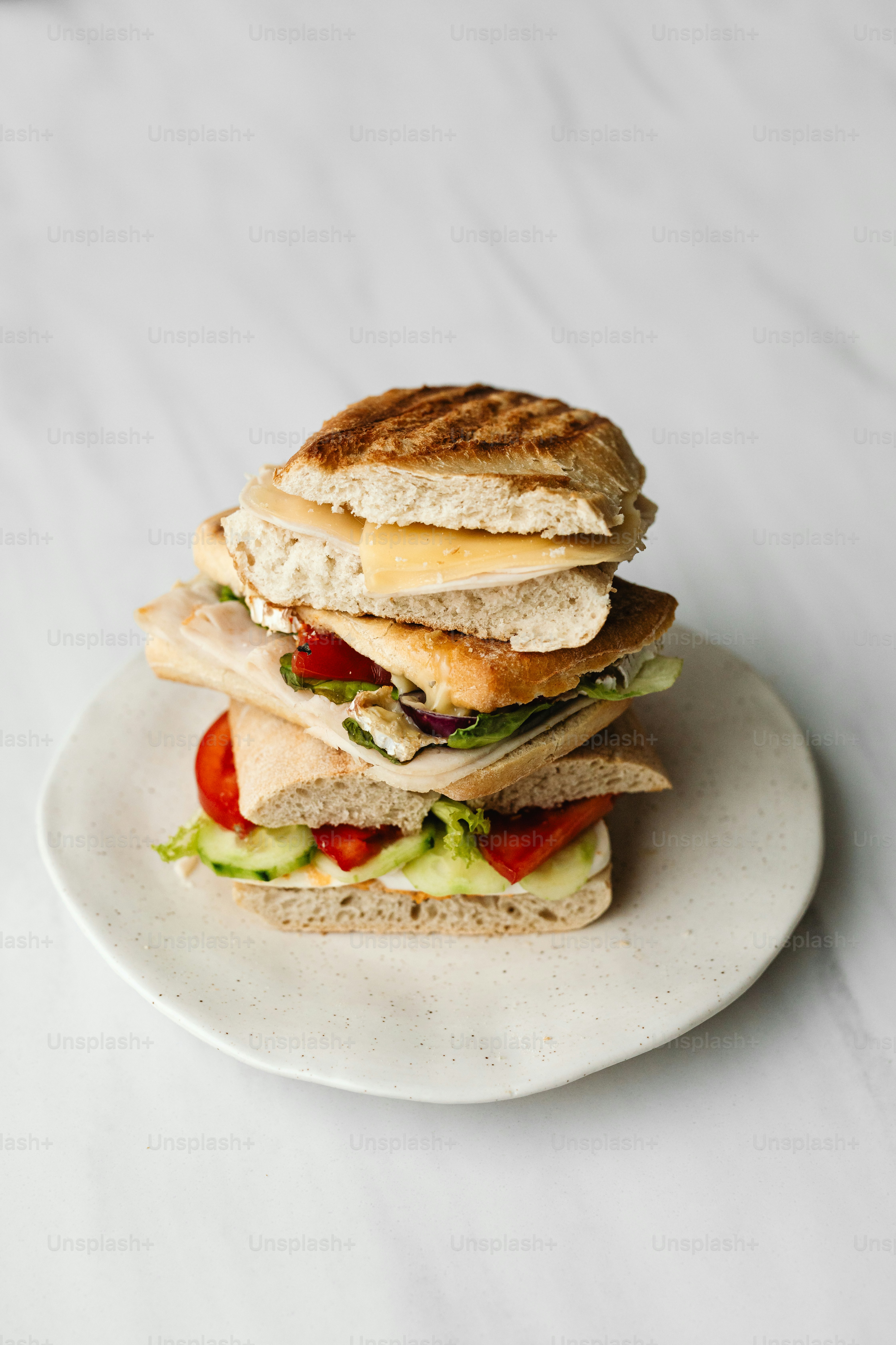A white plate topped with a stack of sandwiches photo – Food Image on ...