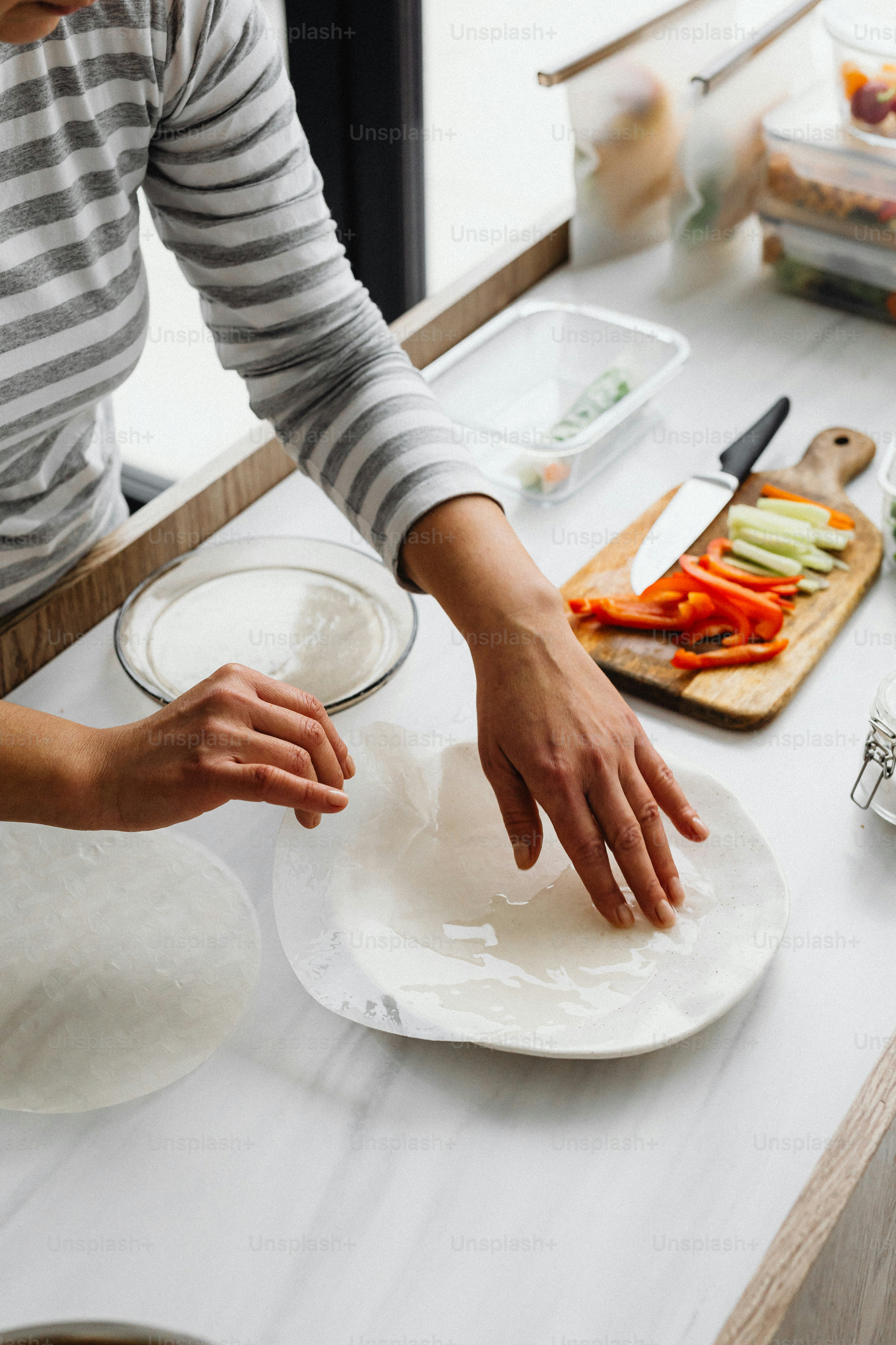 A person is making food on a table photo – Meal prepping Image on Unsplash