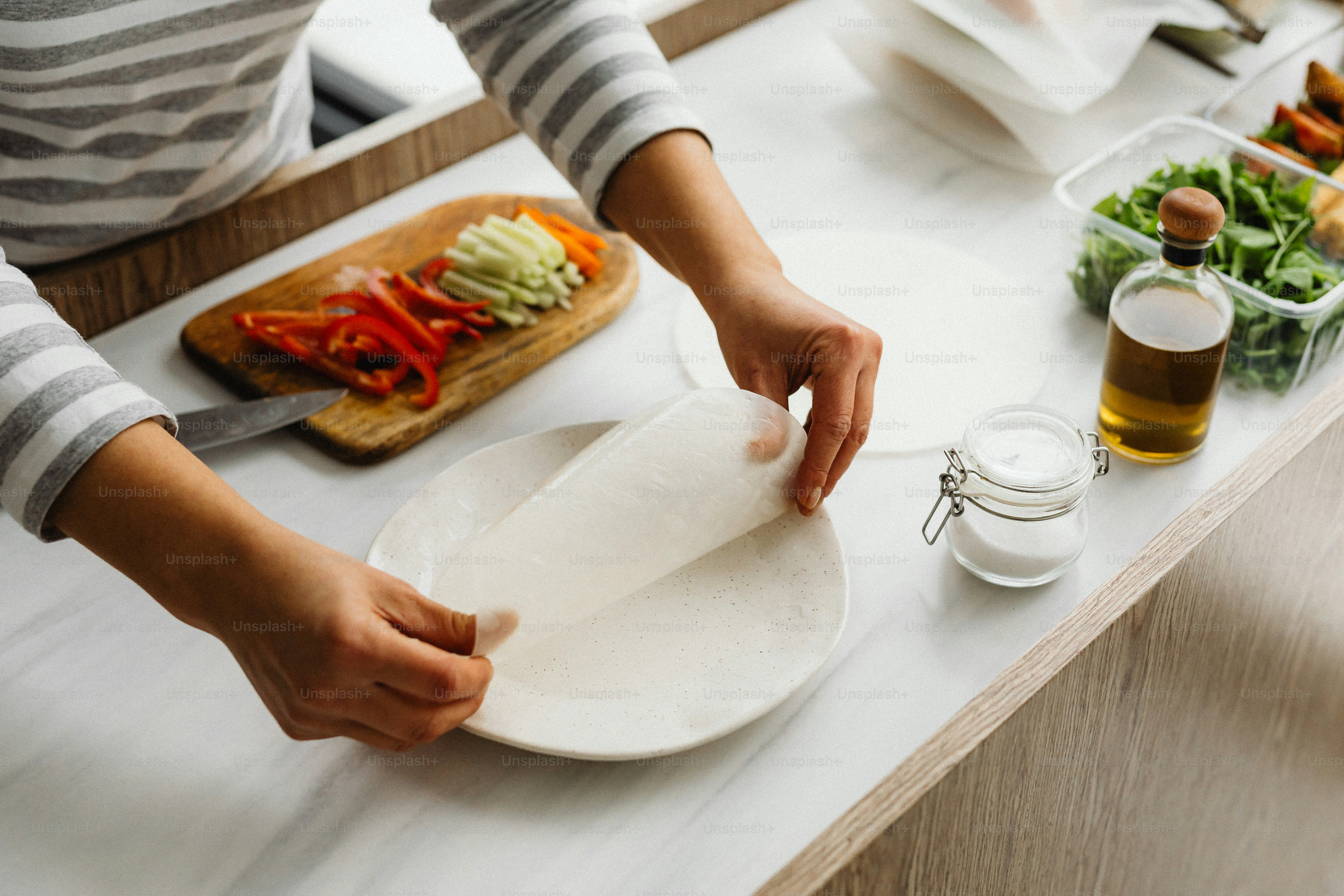 A person holding a piece of paper over a plate photo – Meal prepping ...