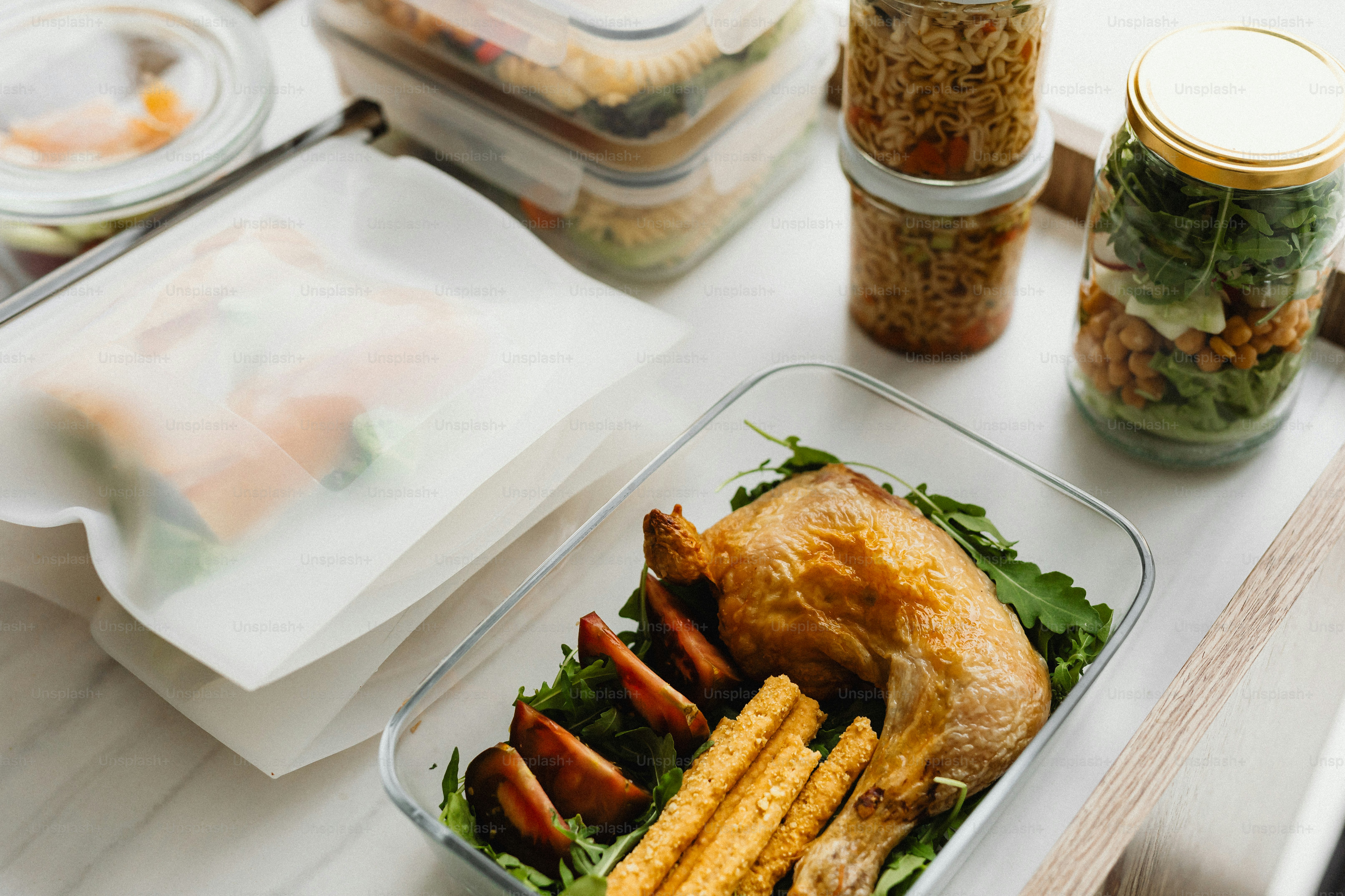A tray of food on a table with a turkey and corn on the cob photo ...