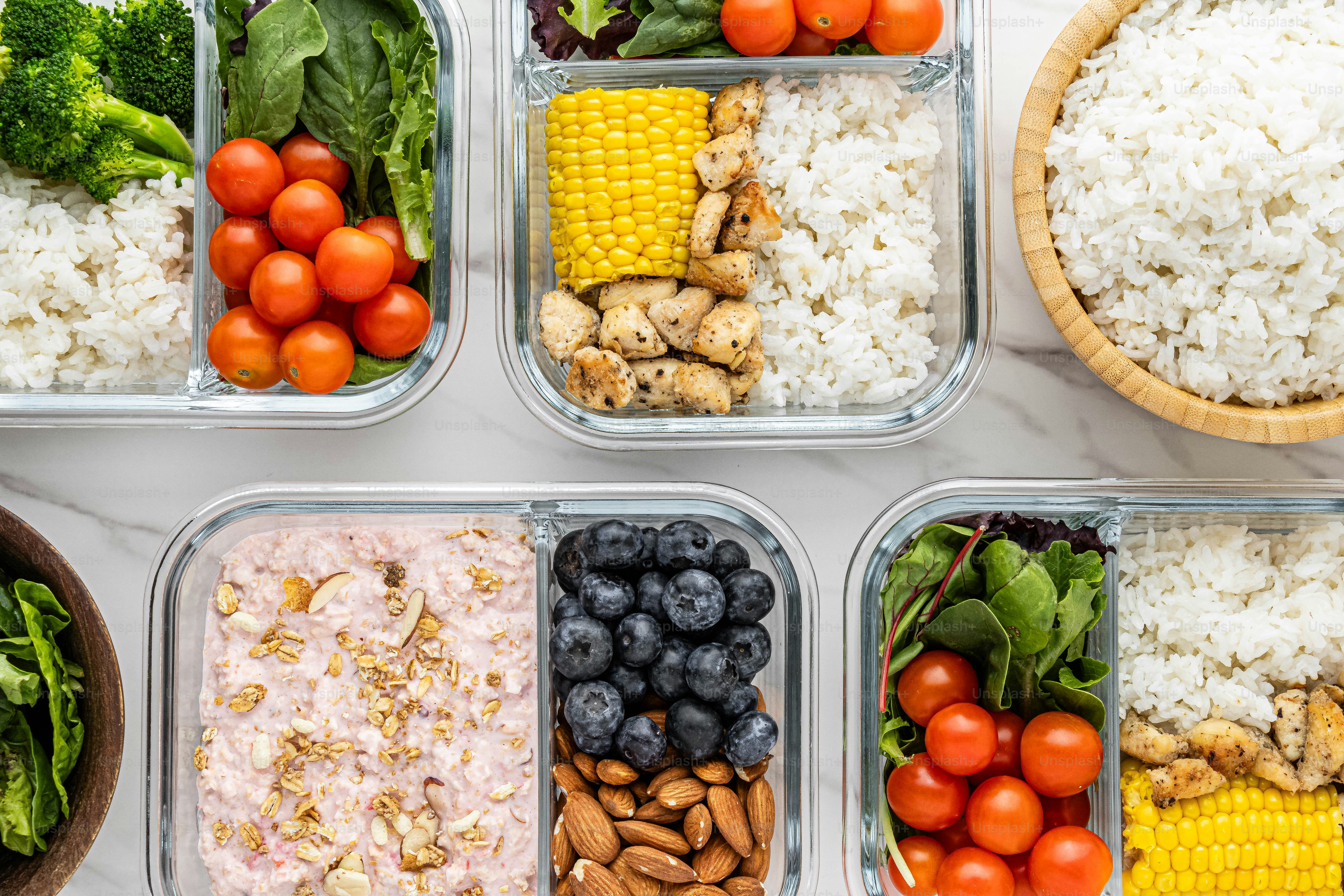 Four plastic containers filled with different types of food photo ...