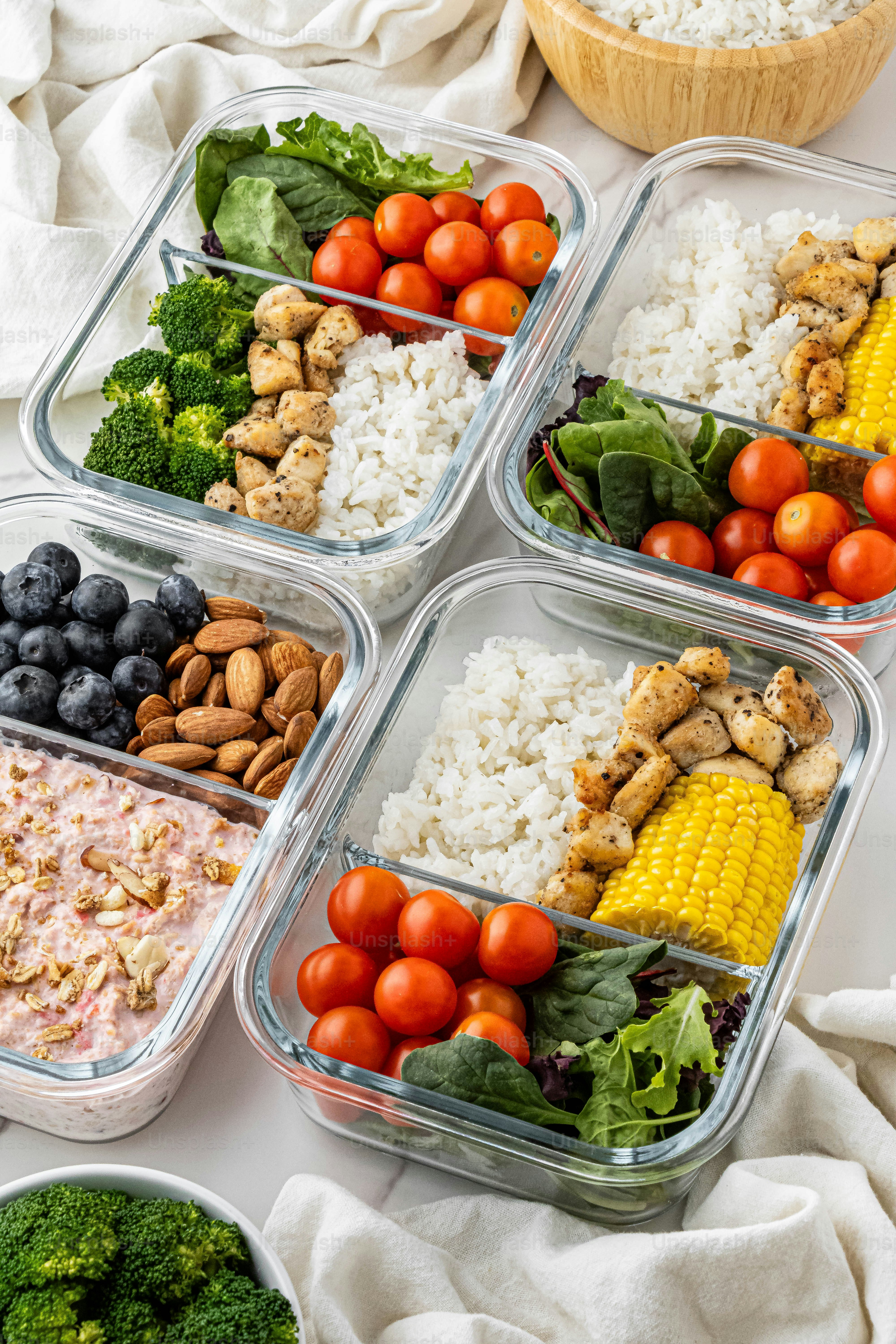 Four plastic containers filled with different types of food photo ...