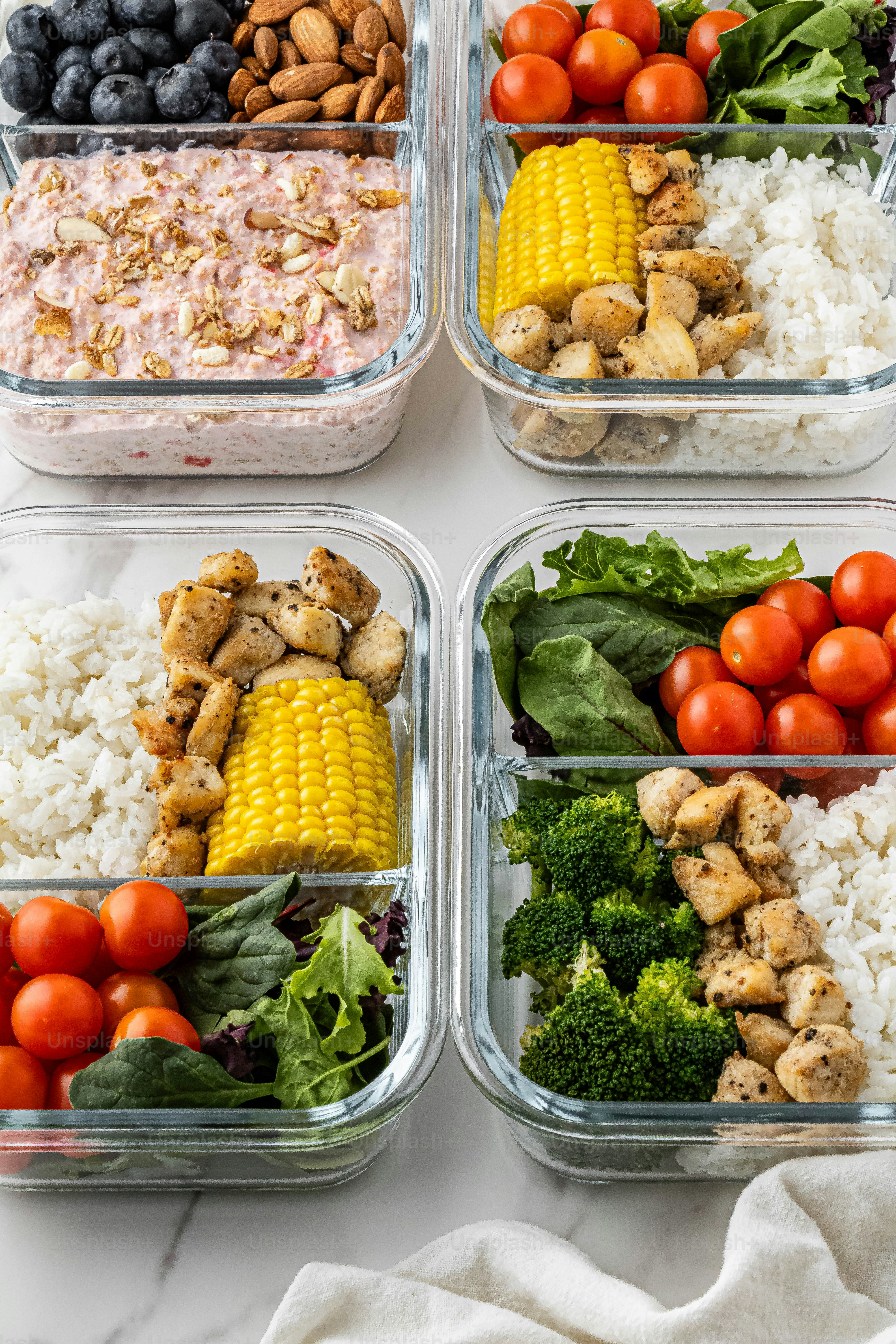 Four plastic containers filled with different types of food photo ...