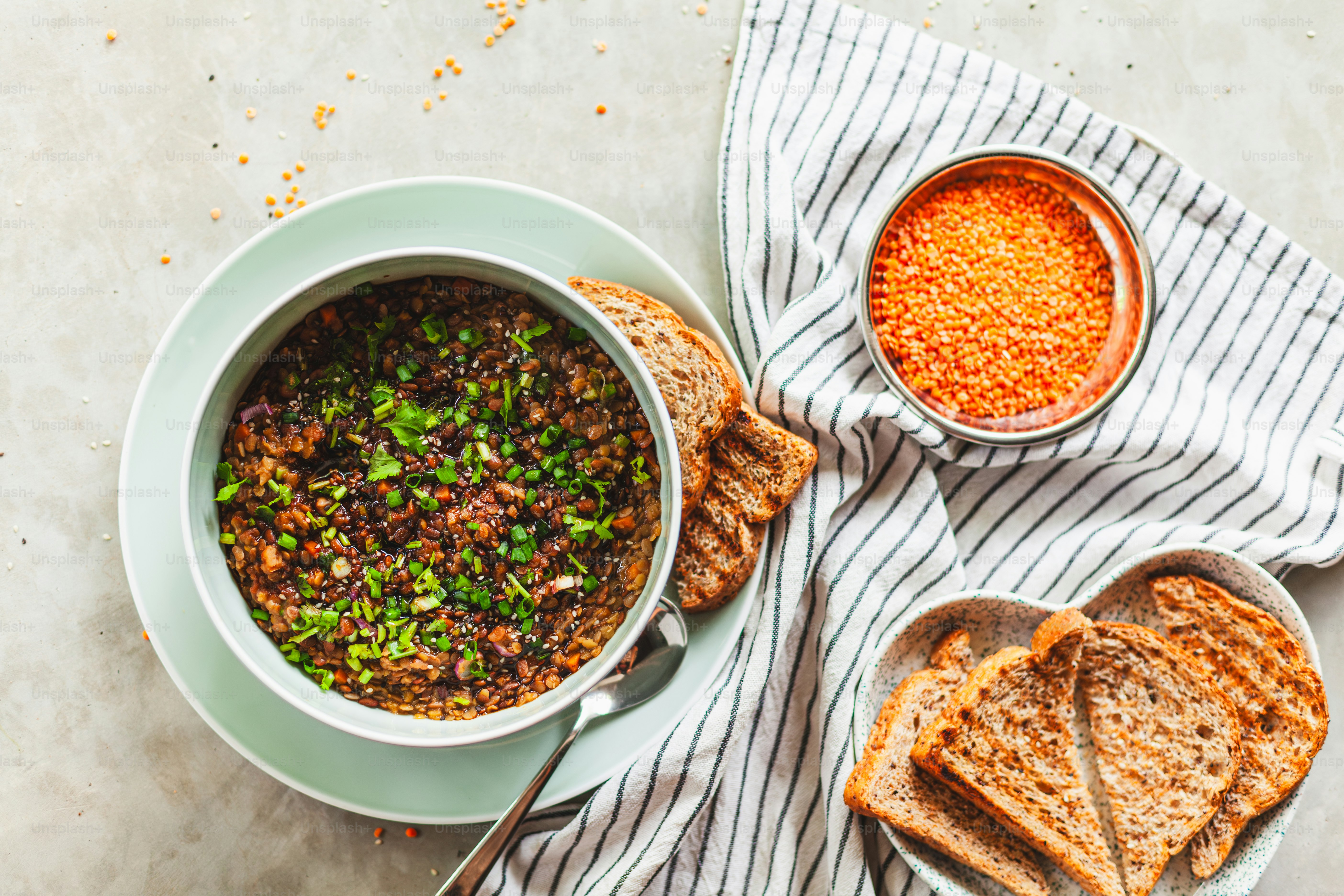 A bowl of beans and bread on a table photo – Food Image on Unsplash