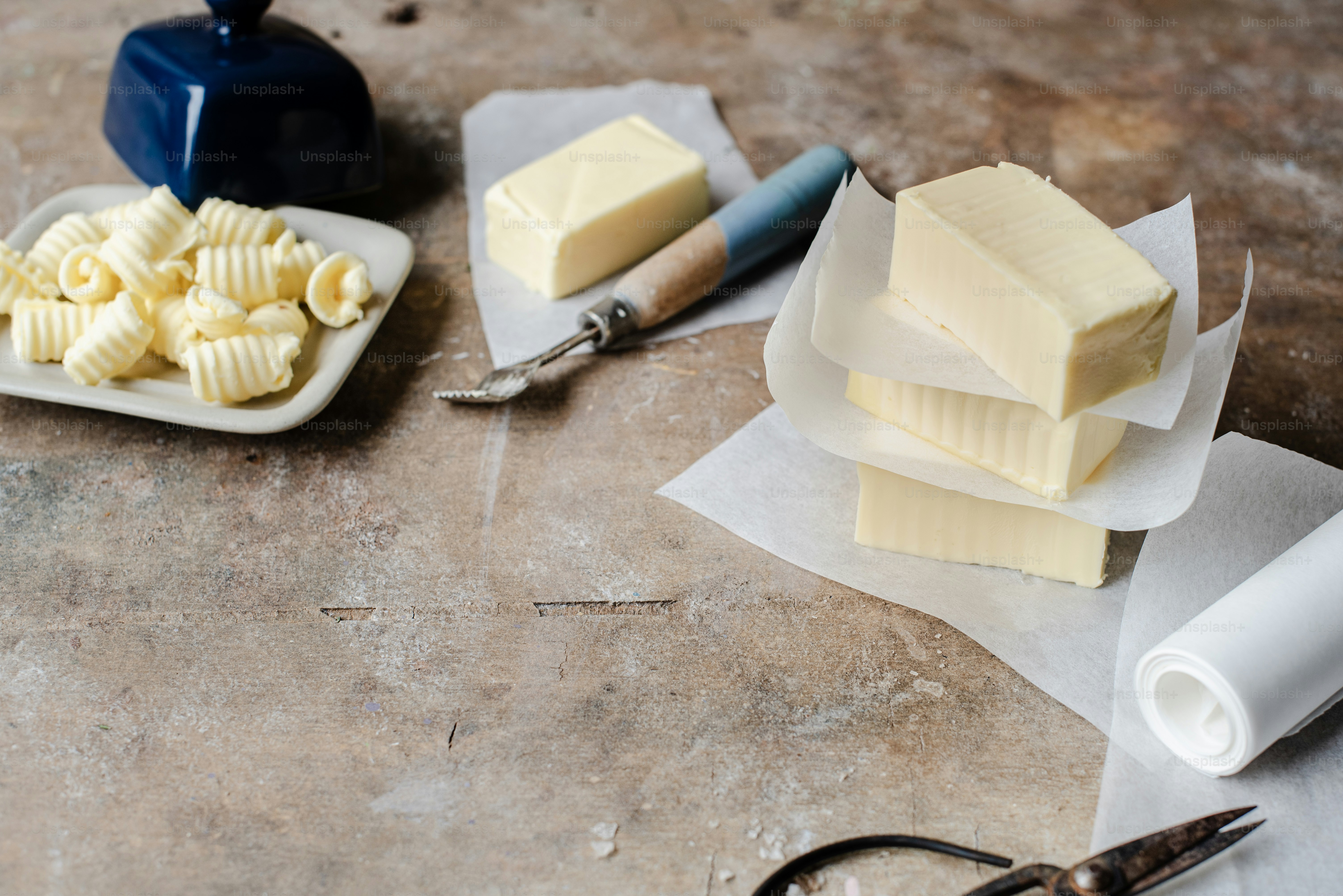 A table topped with lots of different types of food photo – Butter ...
