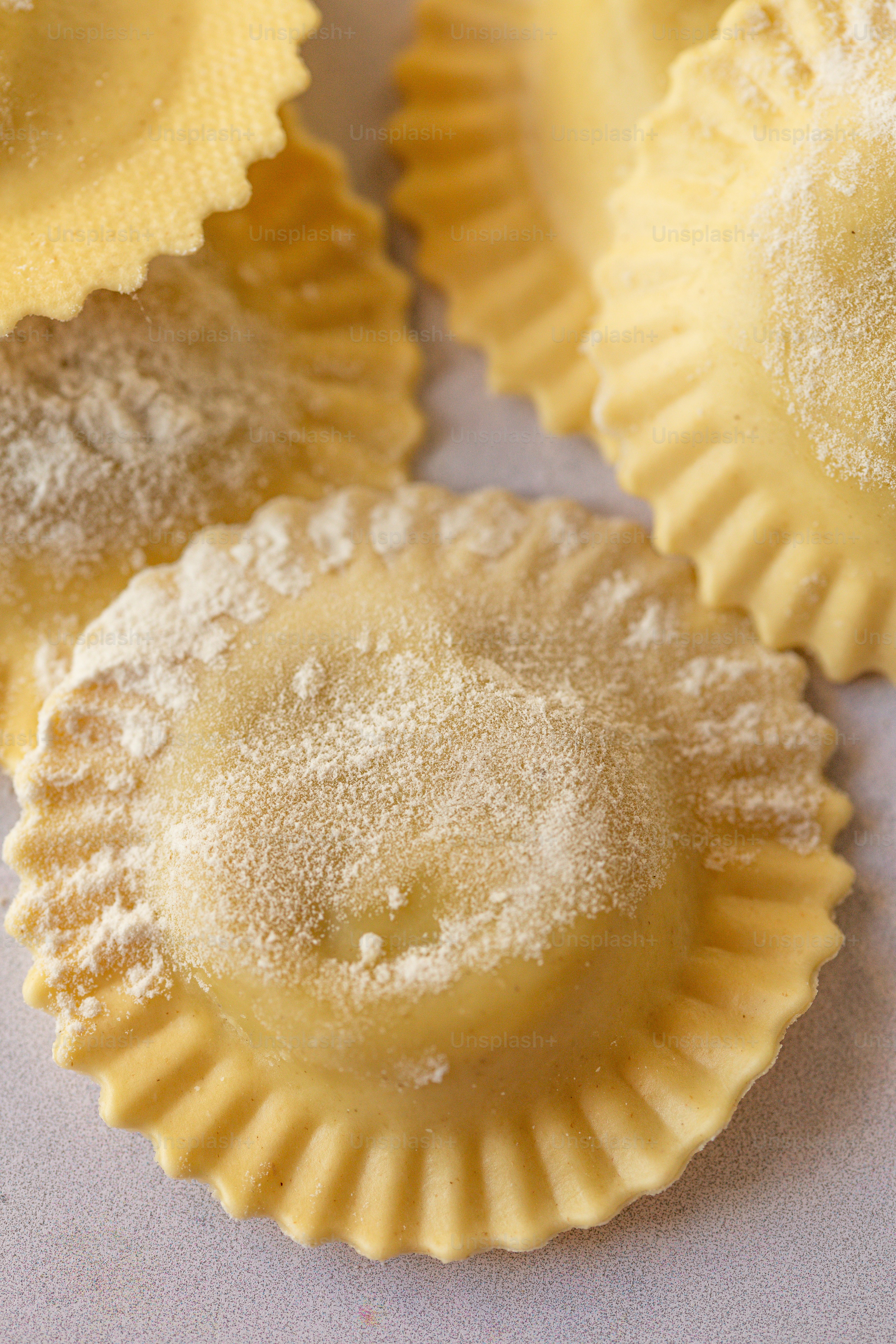 A close up of small pastries covered in powdered sugar photo – Food ...