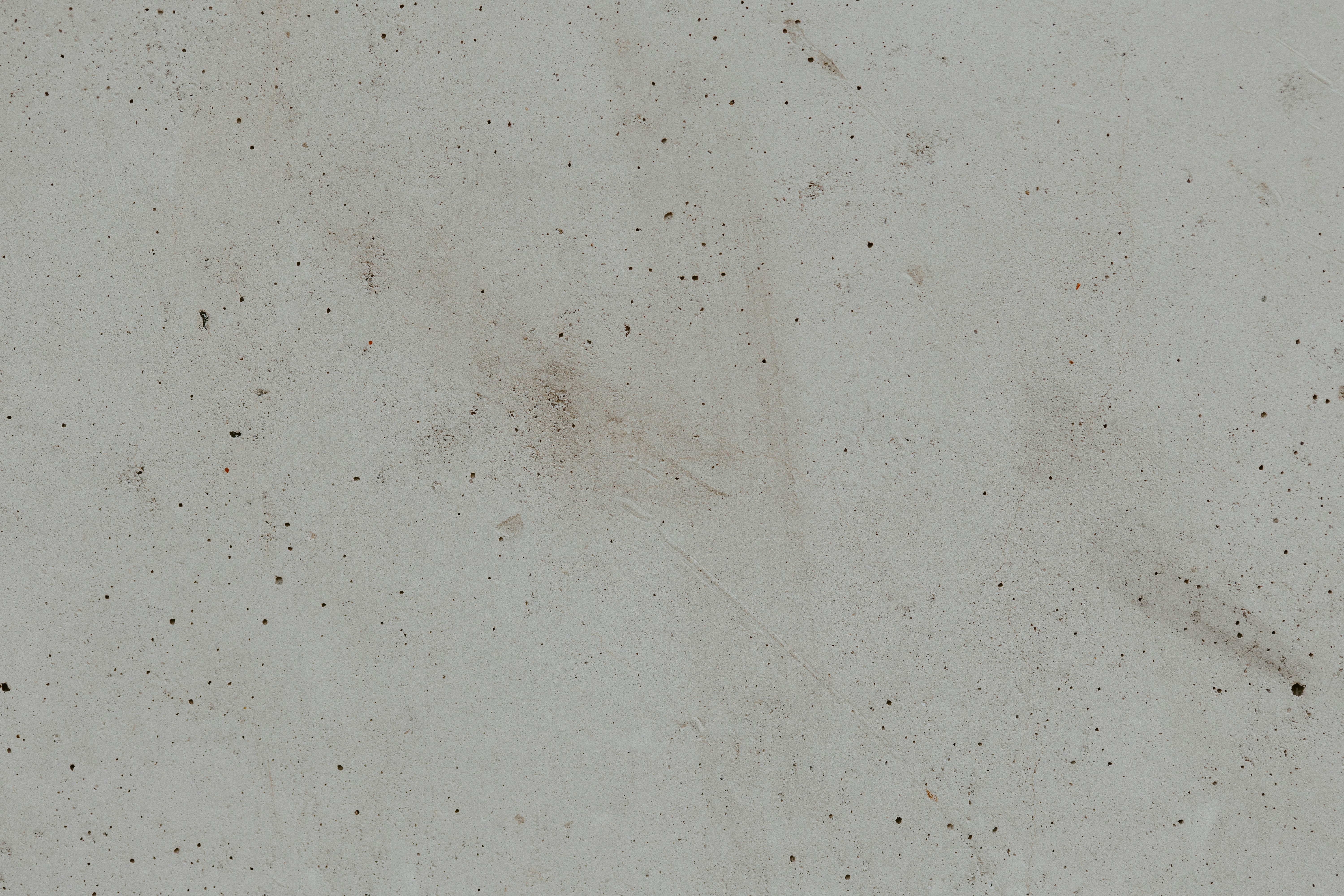 A close up of a cement surface with dirt on it photo – Texture Image on ...