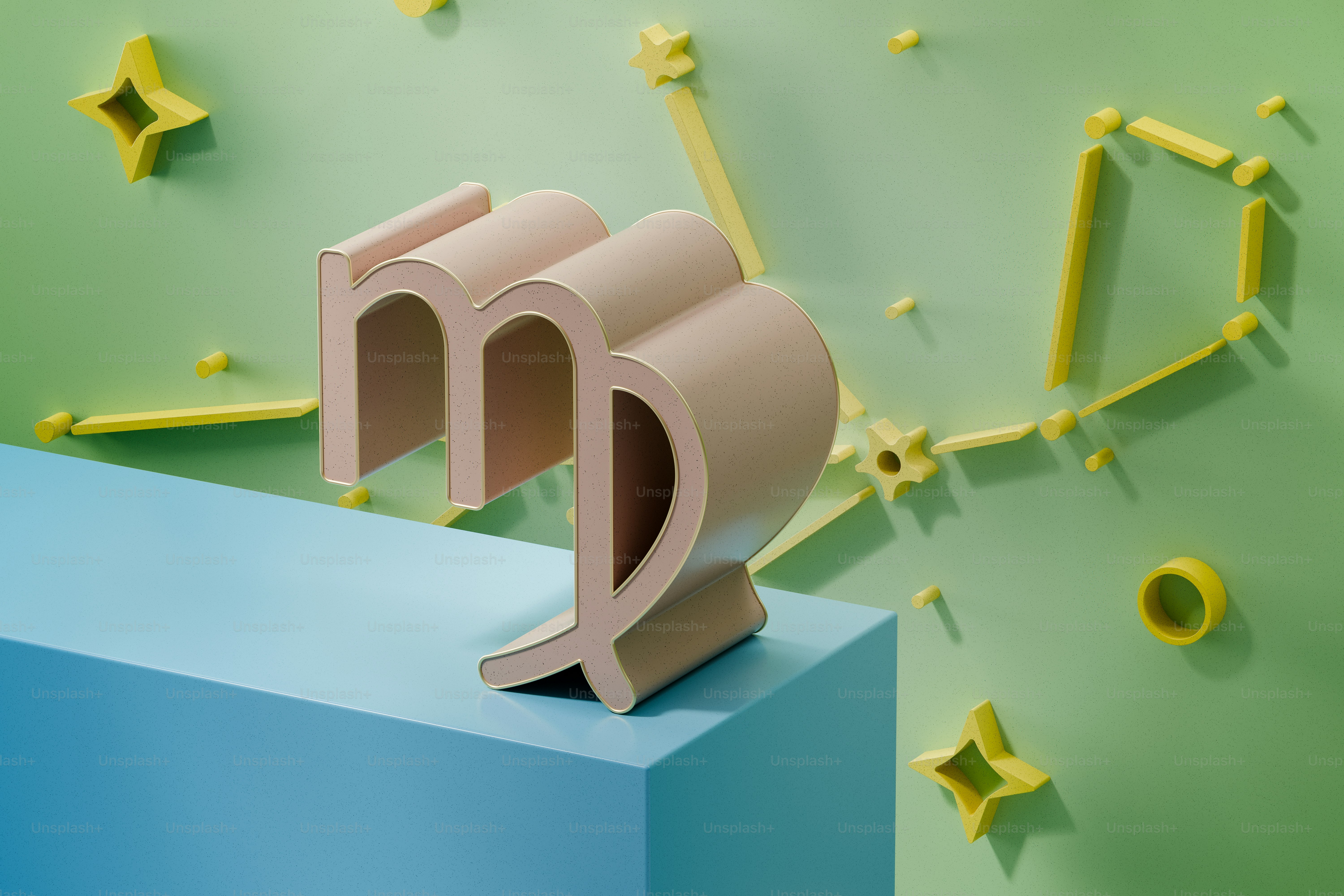 A sculpture of a letter m on top of a blue block photo – Virgo Image on ...
