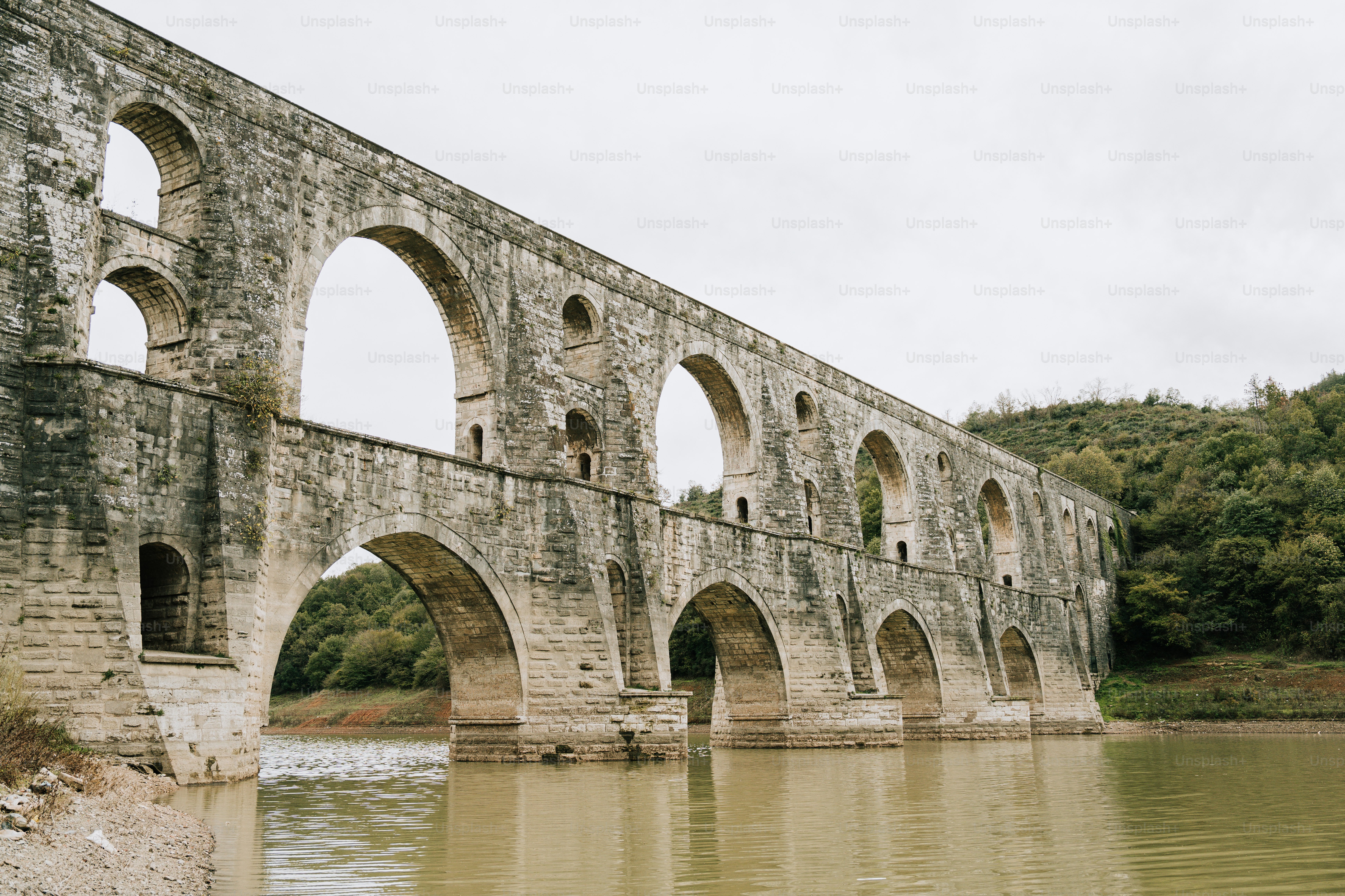 A large stone bridge over a body of water photo – Eyüpsultan/i̇stanbul ...