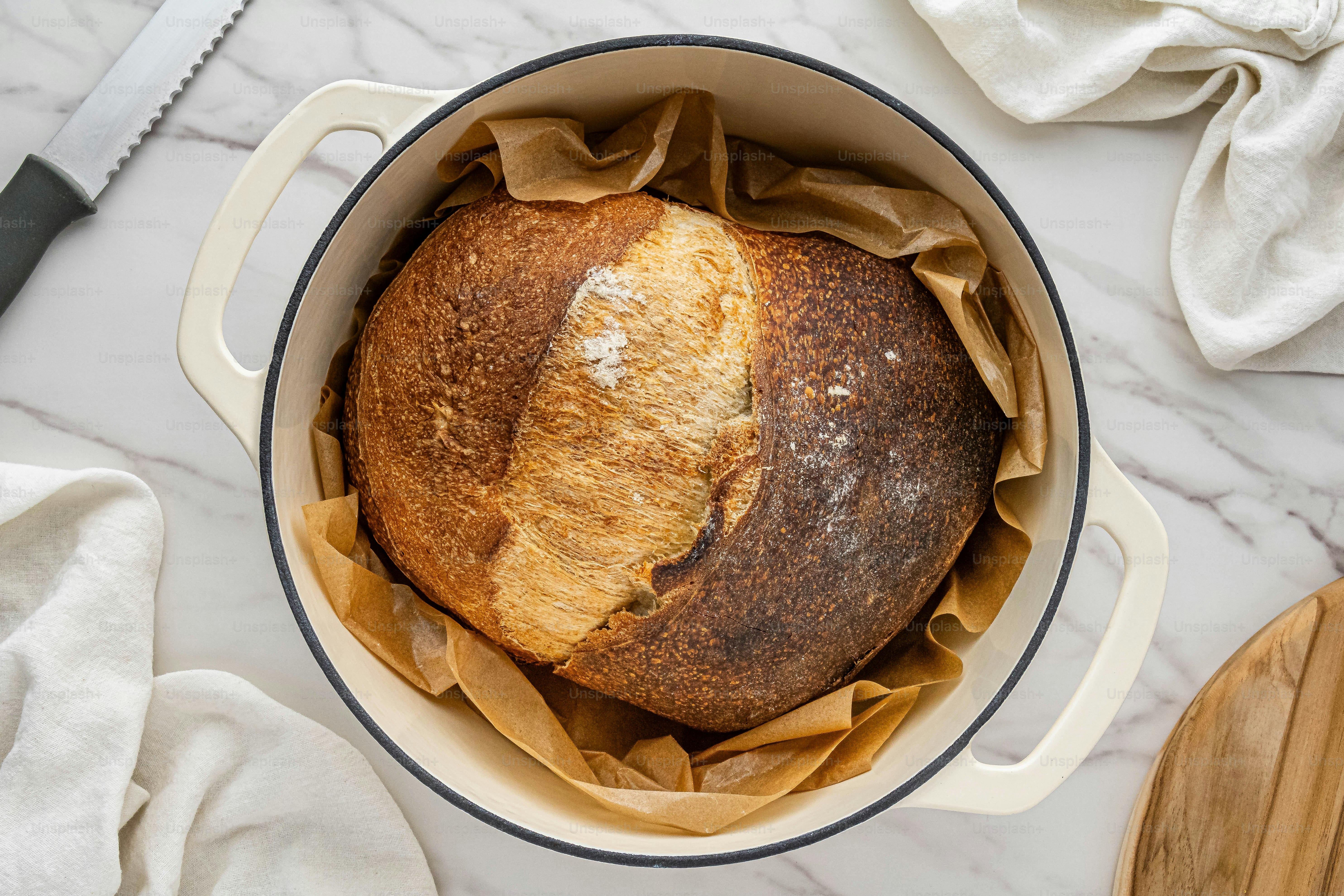 A close up of a piece of bread with holes in it photo – Sourdough Image ...