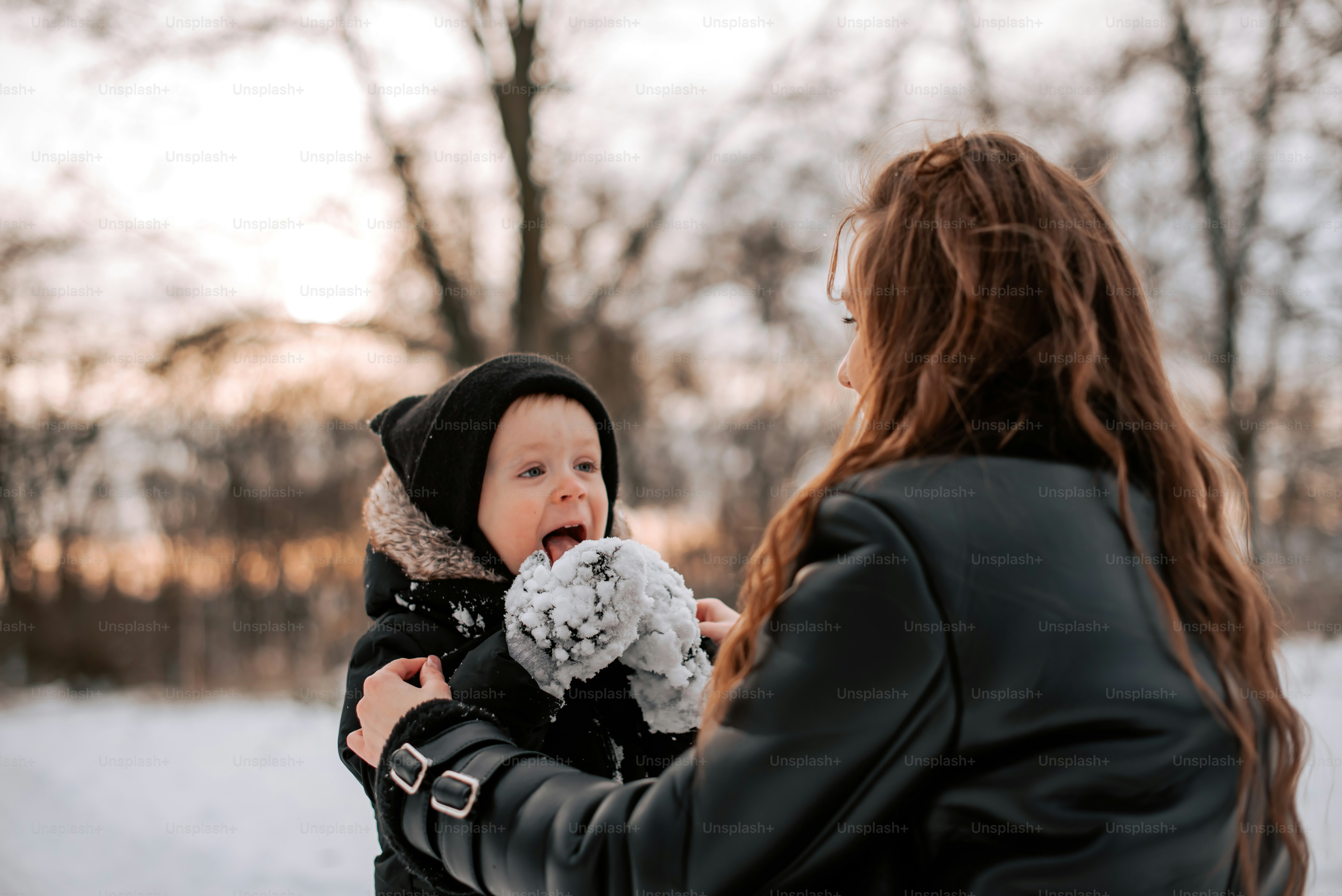 A couple of people that are walking in the snow photo – Family Image on ...