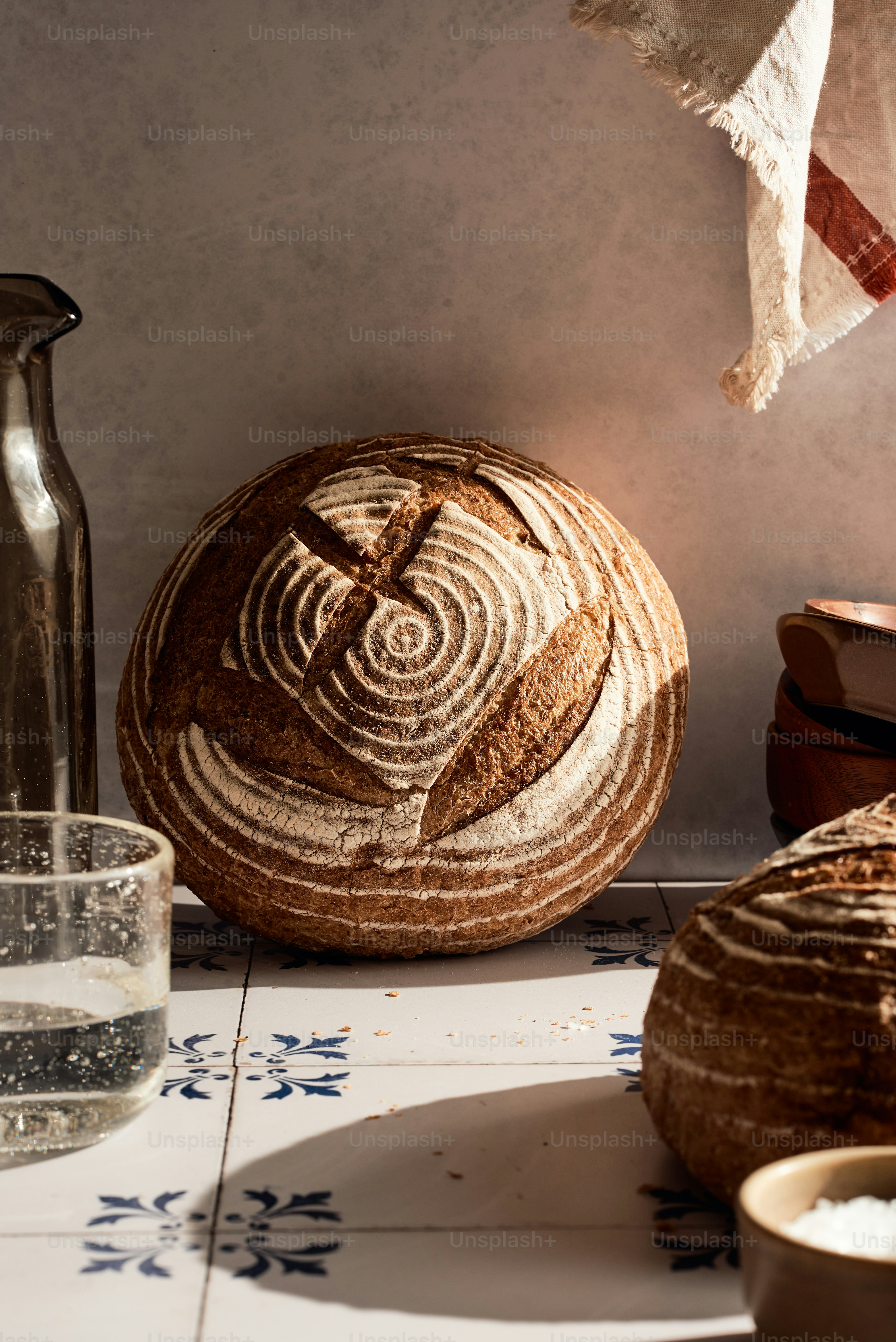 A loaf of bread next to a glass of water photo – Food Image on Unsplash