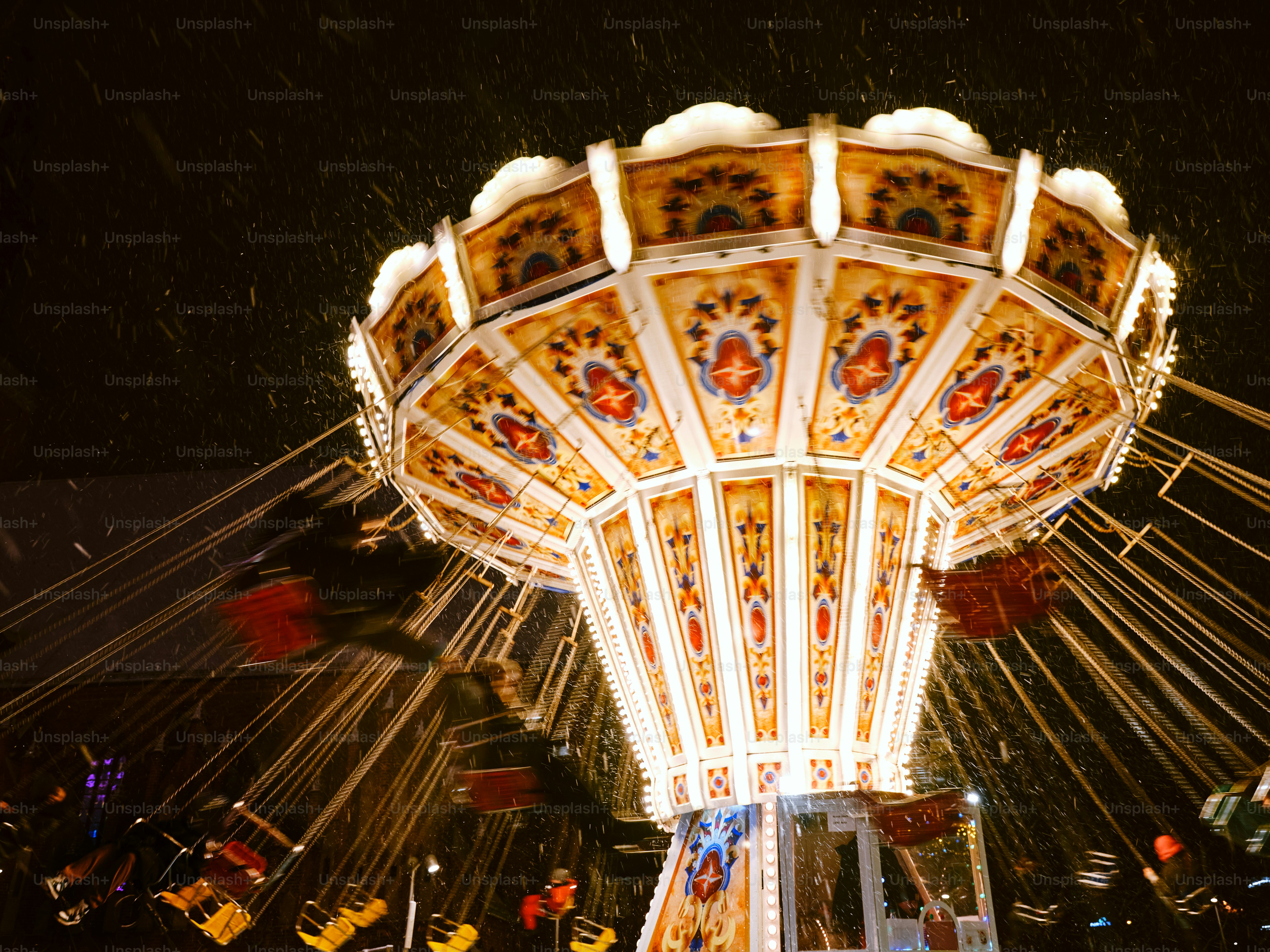 A merry go round ride at night time photo – Germany Image on Unsplash
