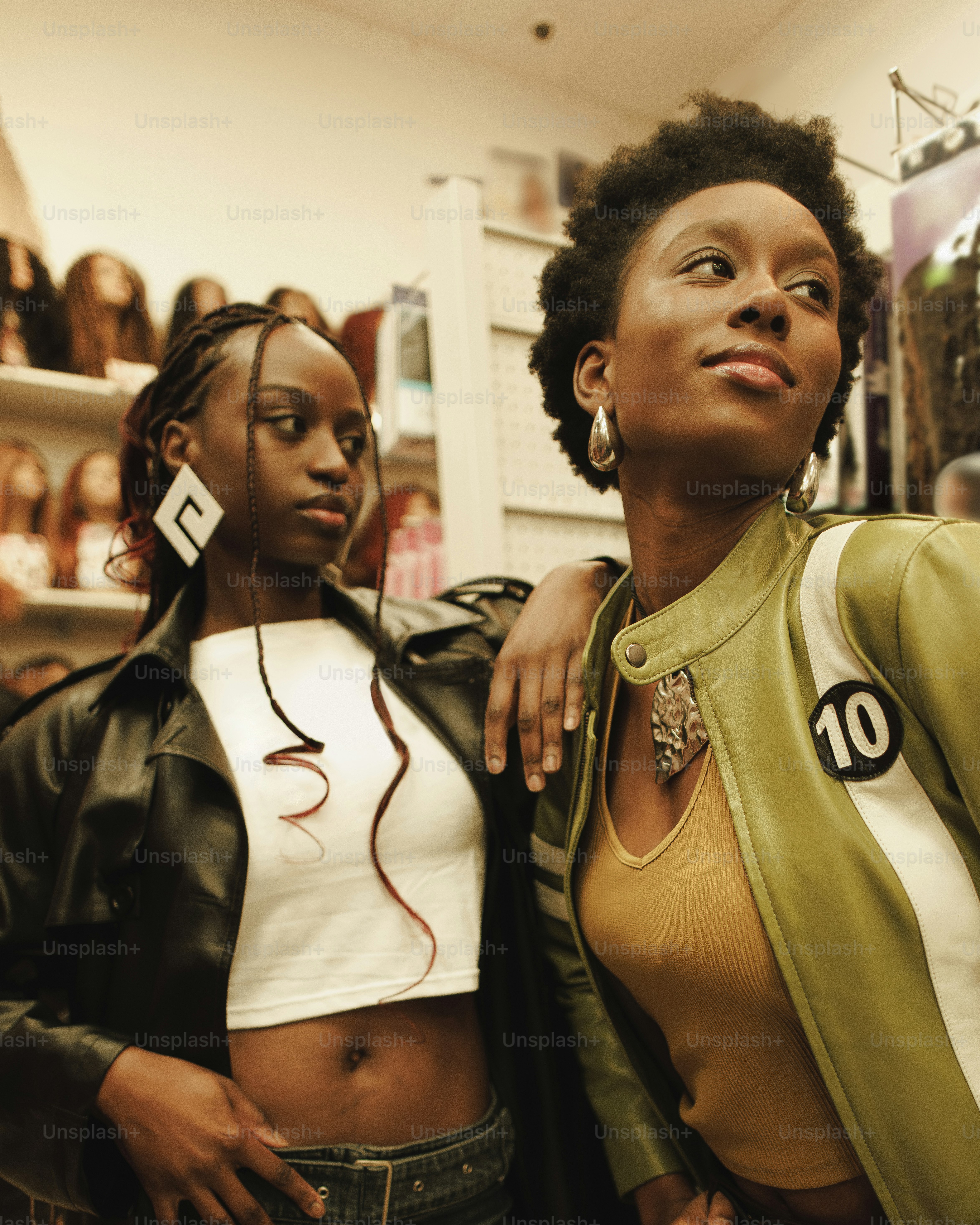 Two women standing next to each other in a store photo – Fashion Image ...