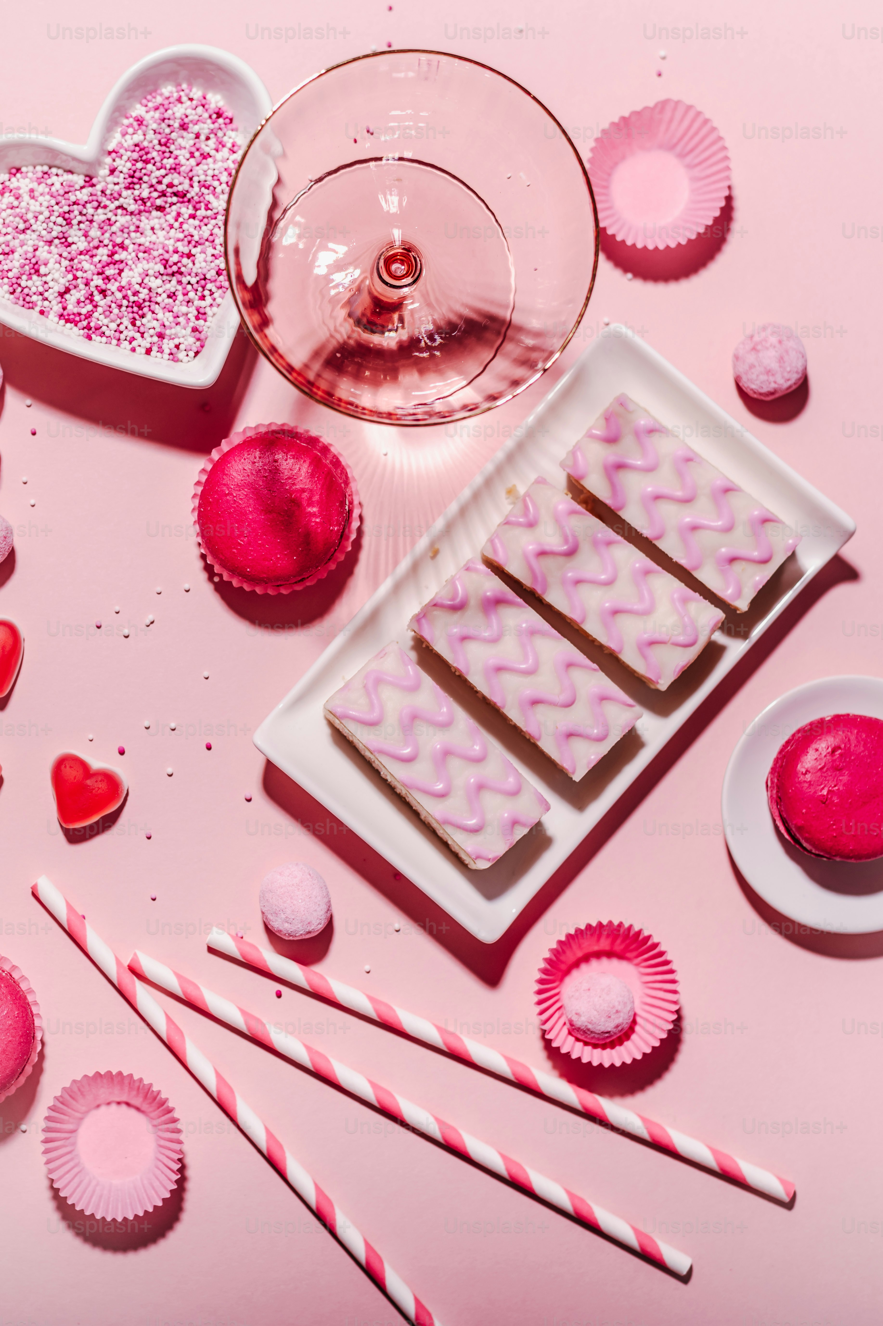 A table topped with lots of pink and red desserts photo – Valentines ...