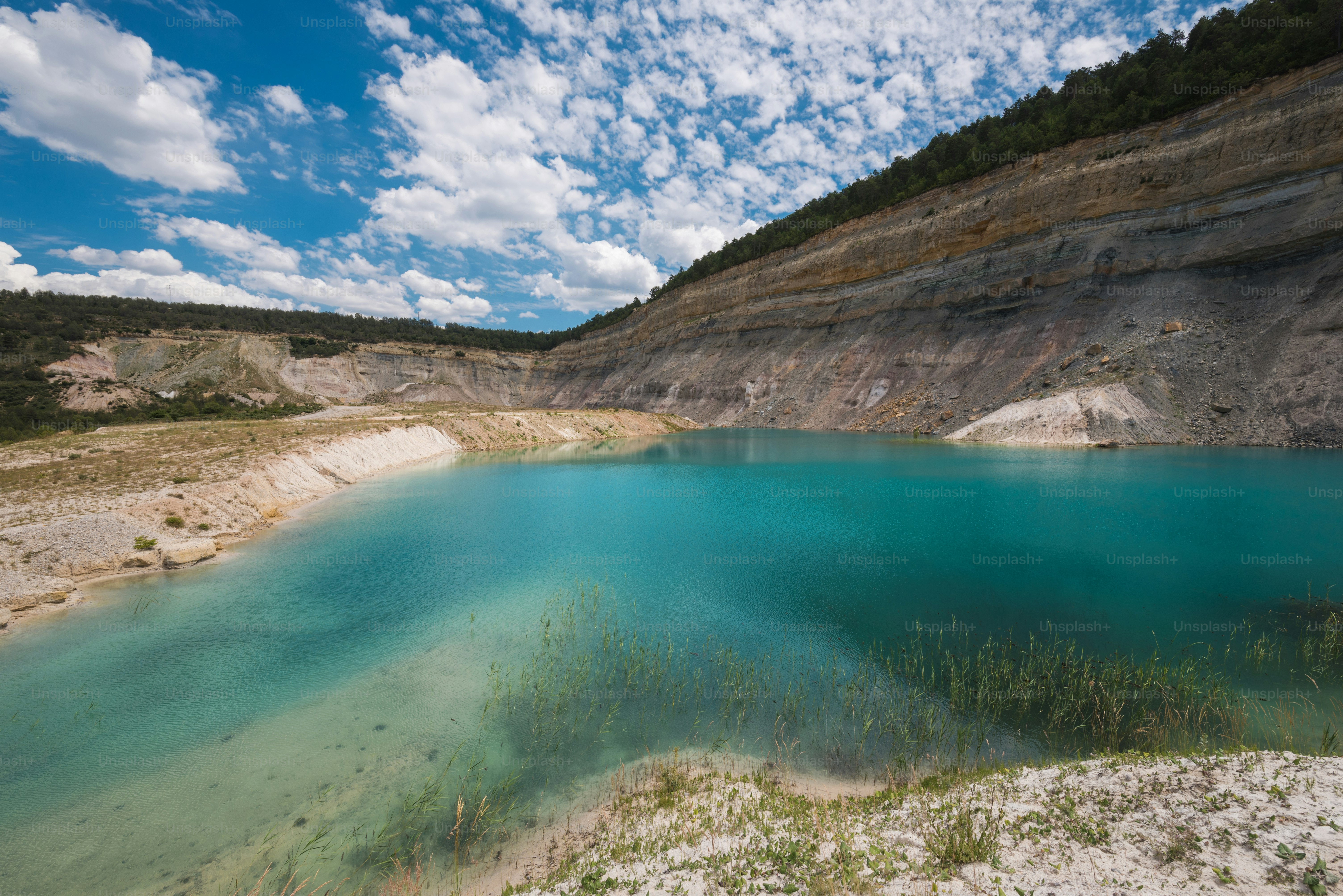 Turqoise lake in an open pit mine photo – Water Image on Unsplash