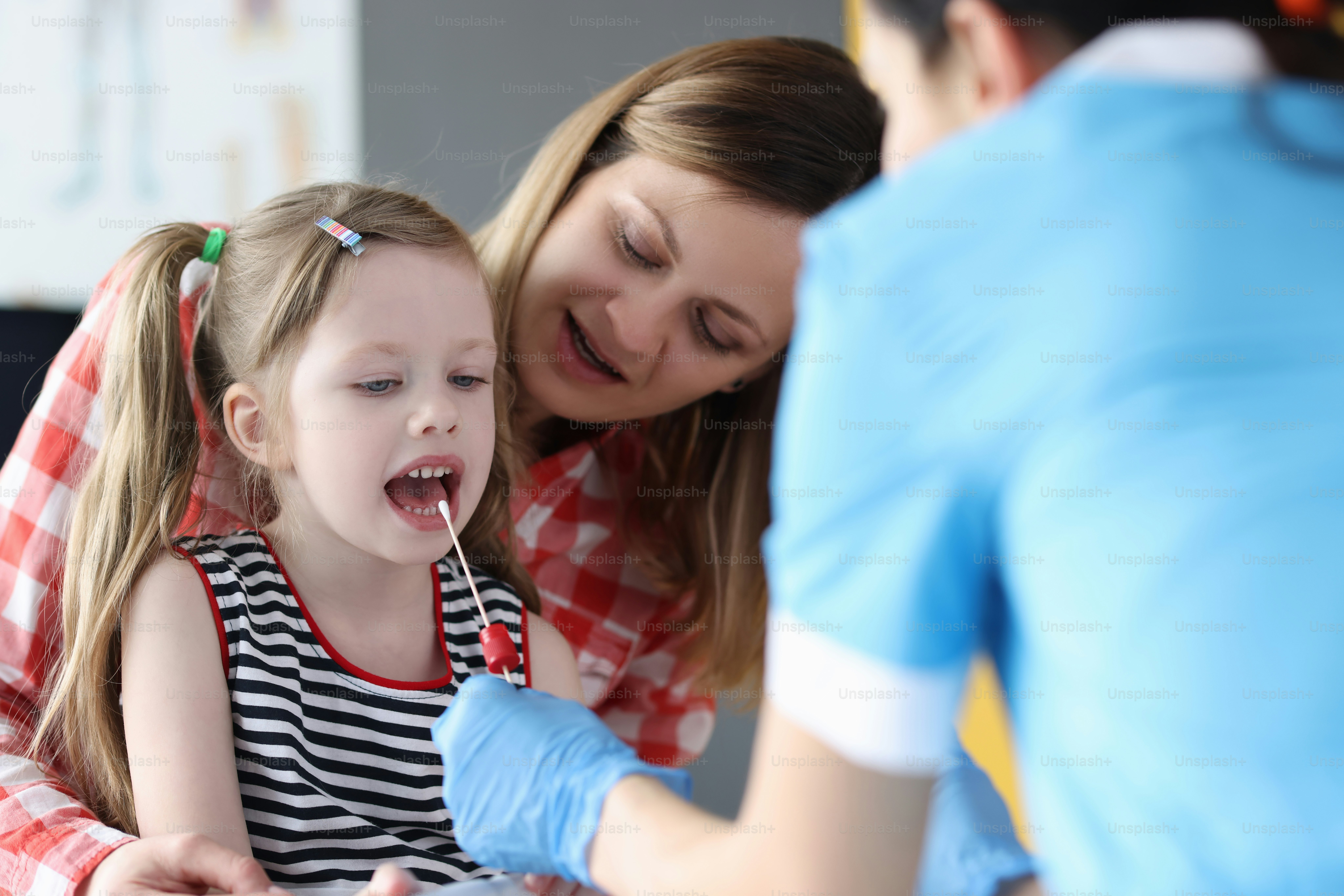 Doctor collects biological material from child saliva. DNA analysis for ...