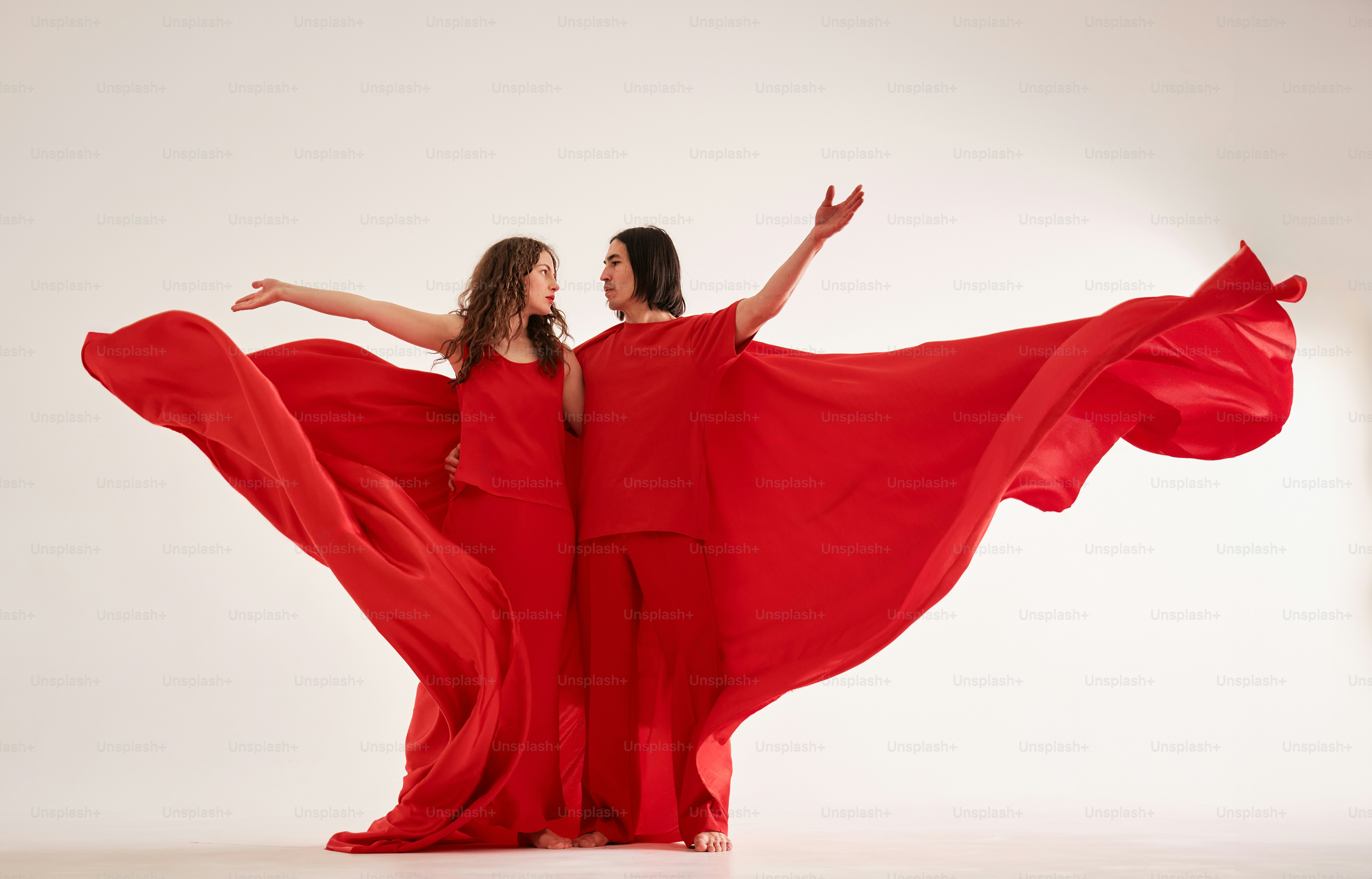 Two women in red dresses are posing for a picture photo – Girl Image on ...