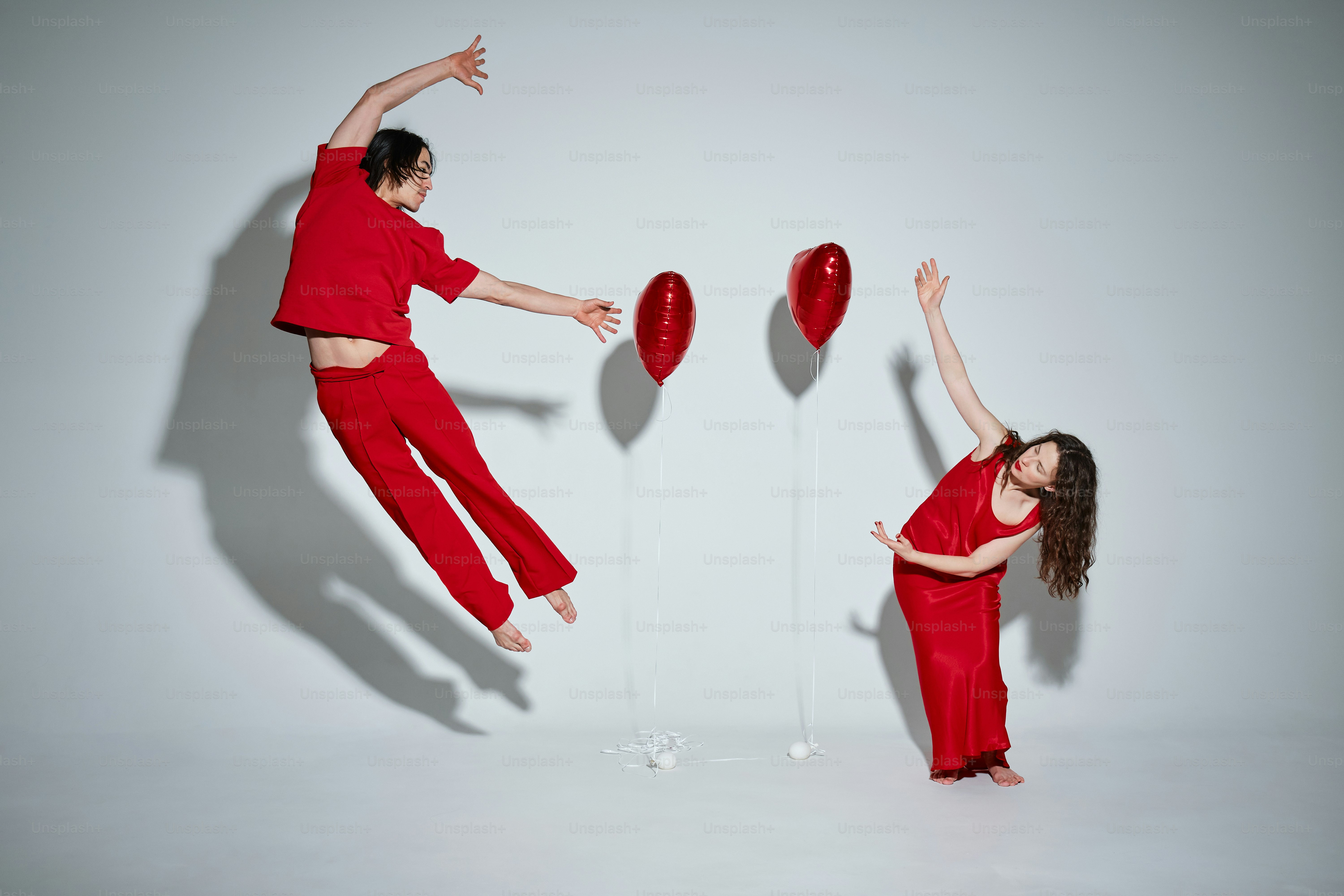 A couple of people that are jumping in the air photo – Valentine Image ...
