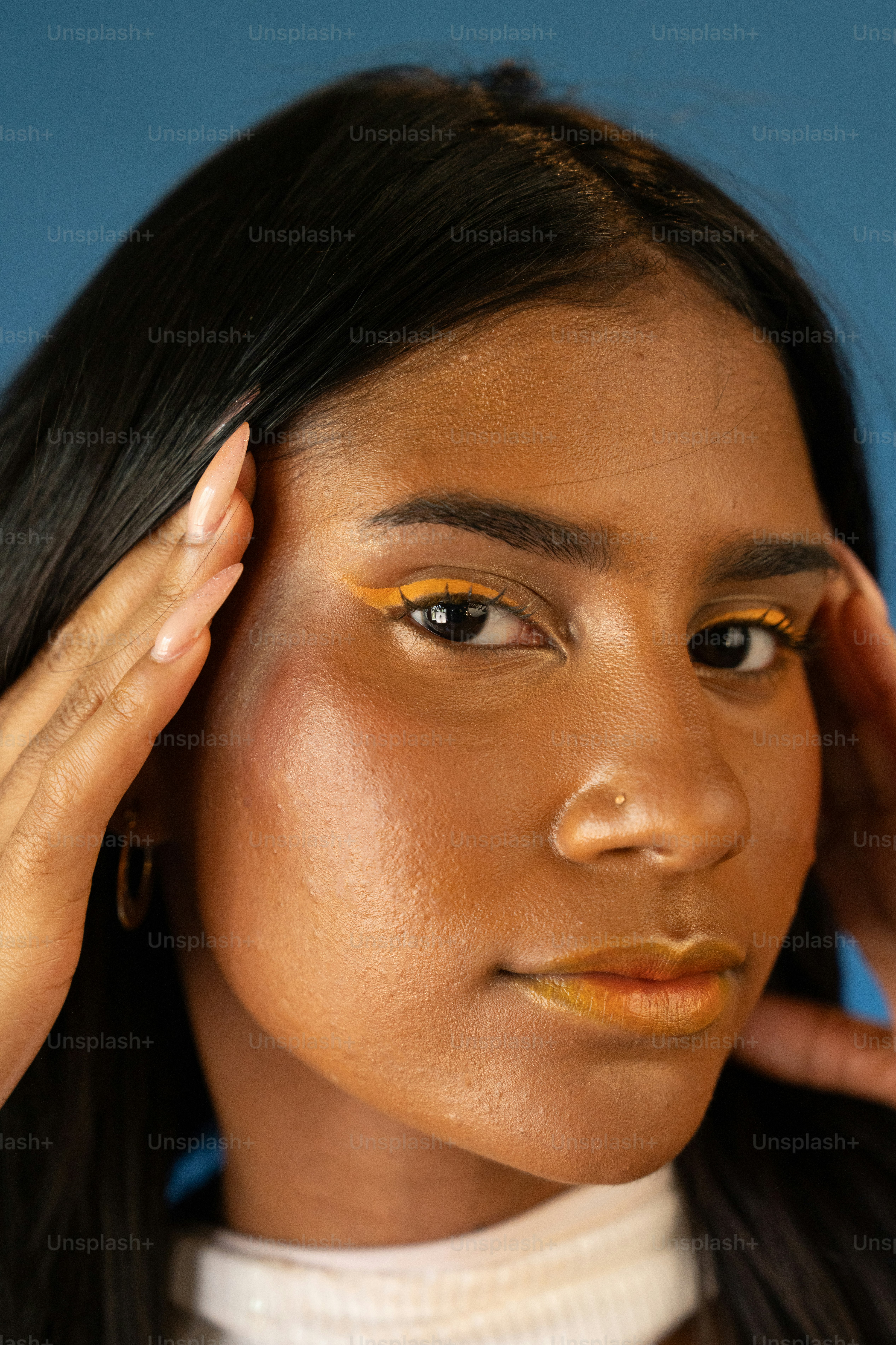 A close up of a person holding their head photo – Foundation Image on ...
