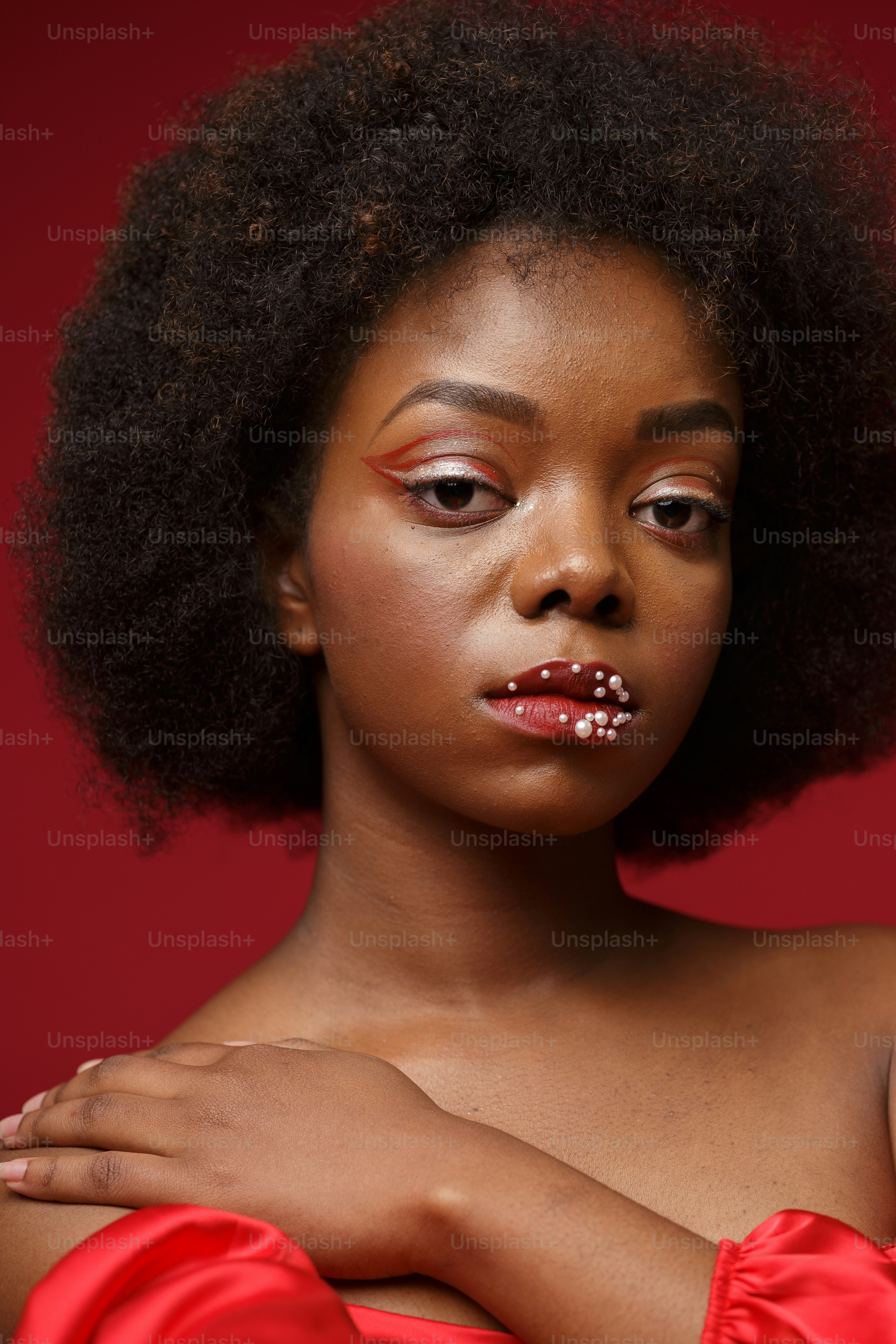 A woman in a red dress with a nose piercing photo – Lipstick Image on ...