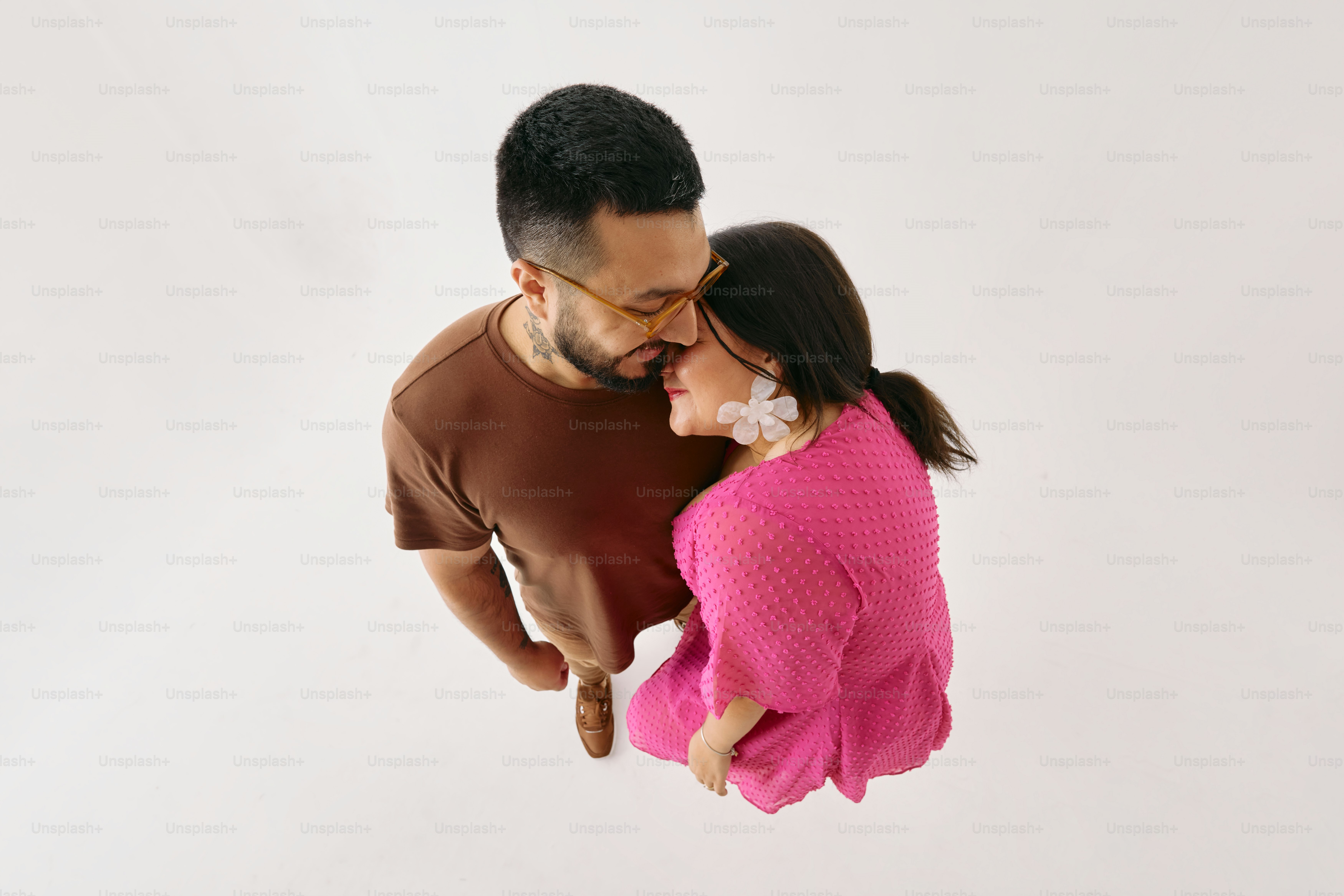 A couple of people standing next to each other photo – Love Image on ...