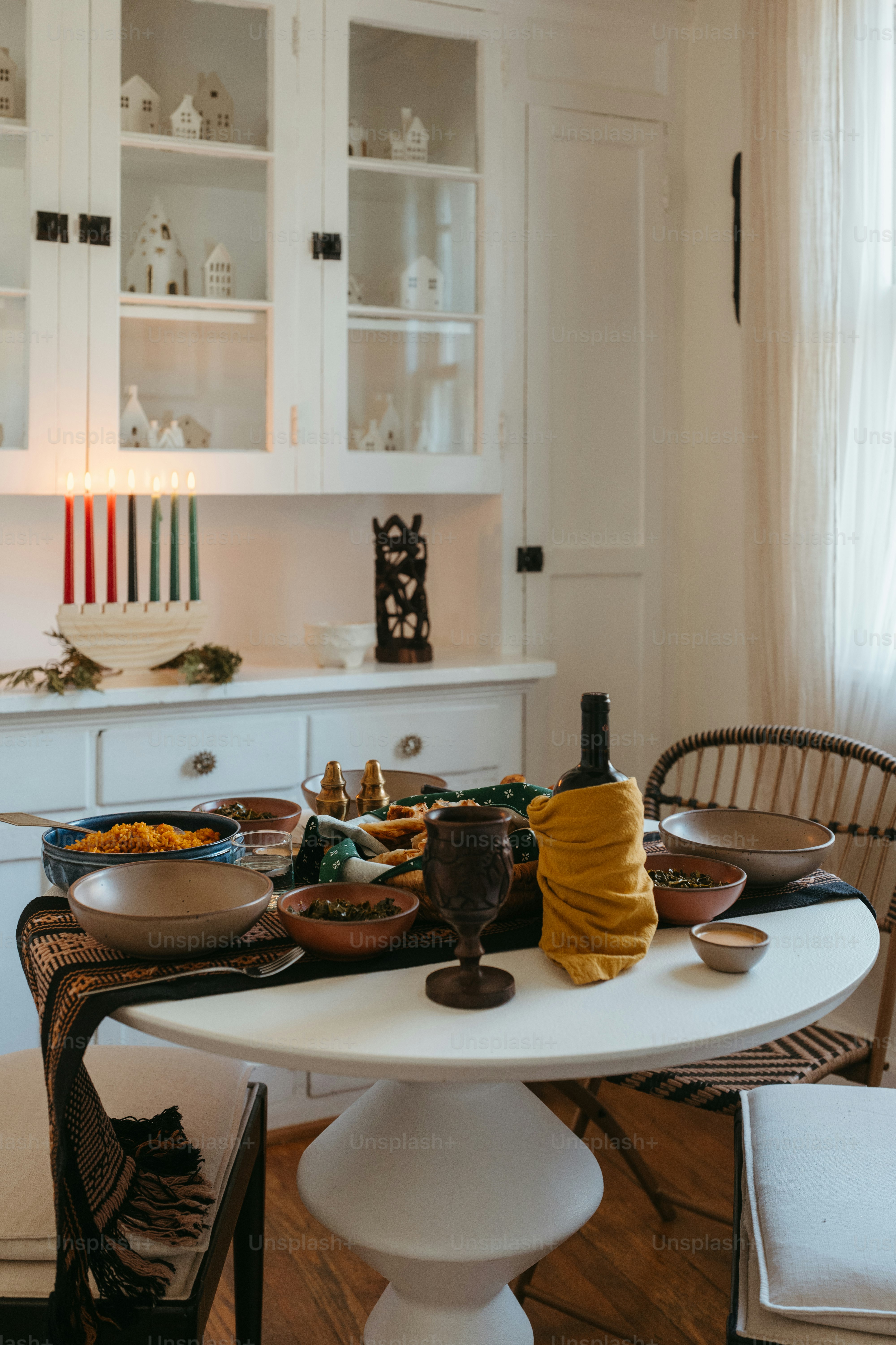 A dining room table with plates of food on it photo – Karamu Image on ...