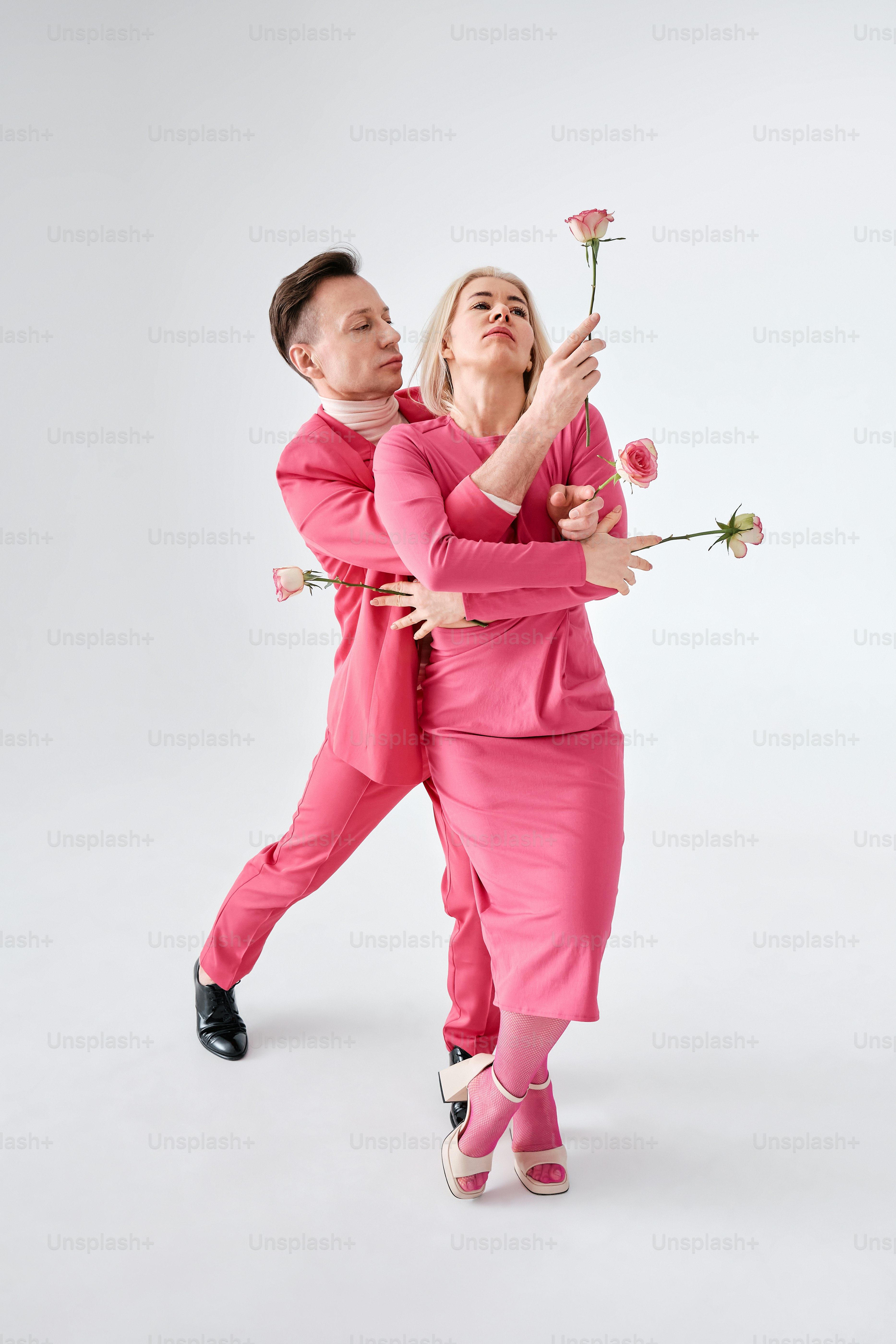 A man and a woman in pink are posing for a picture photo – Love story ...