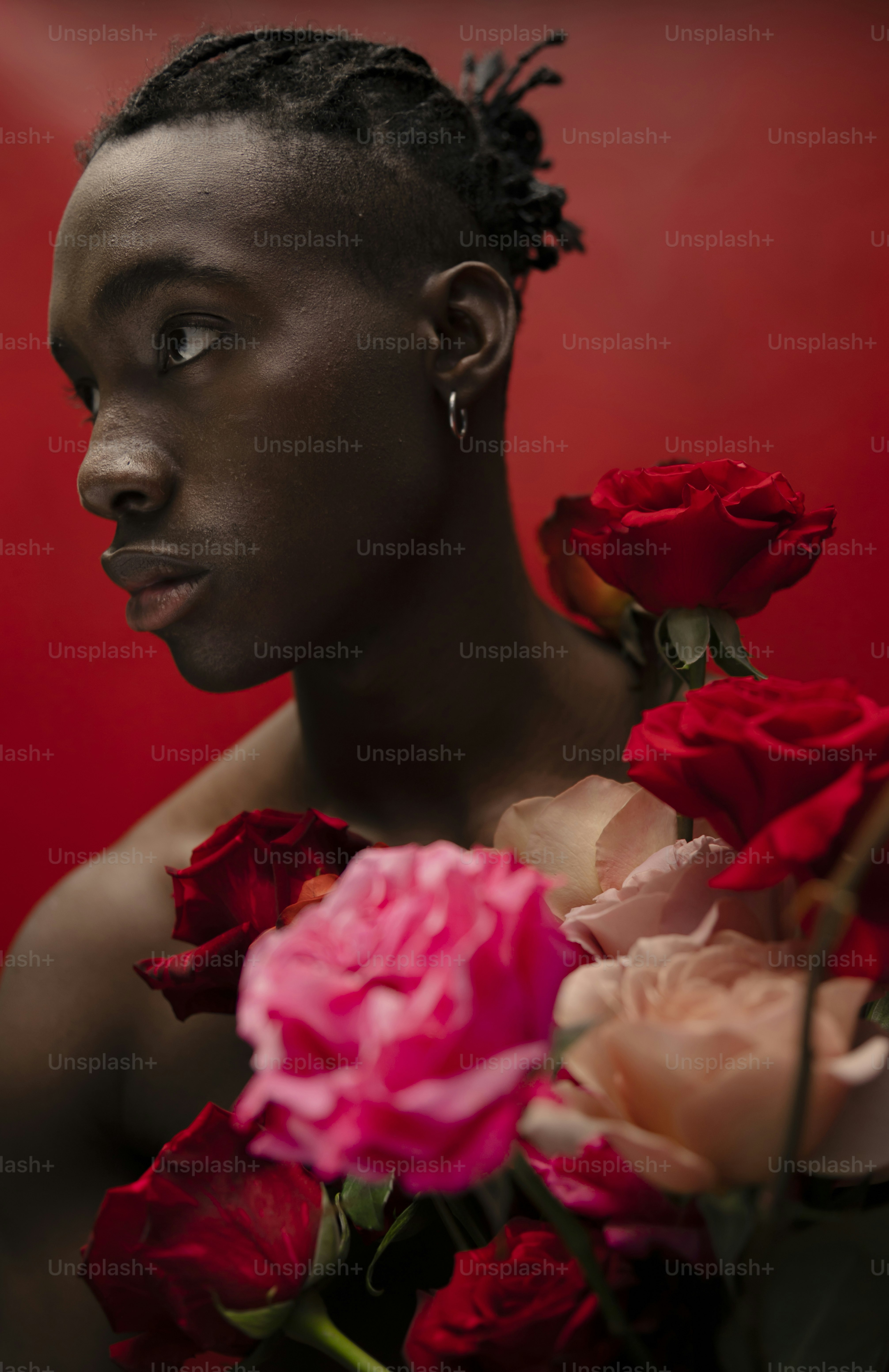 A man in a suit holding a flower photo – Rose flower Image on Unsplash