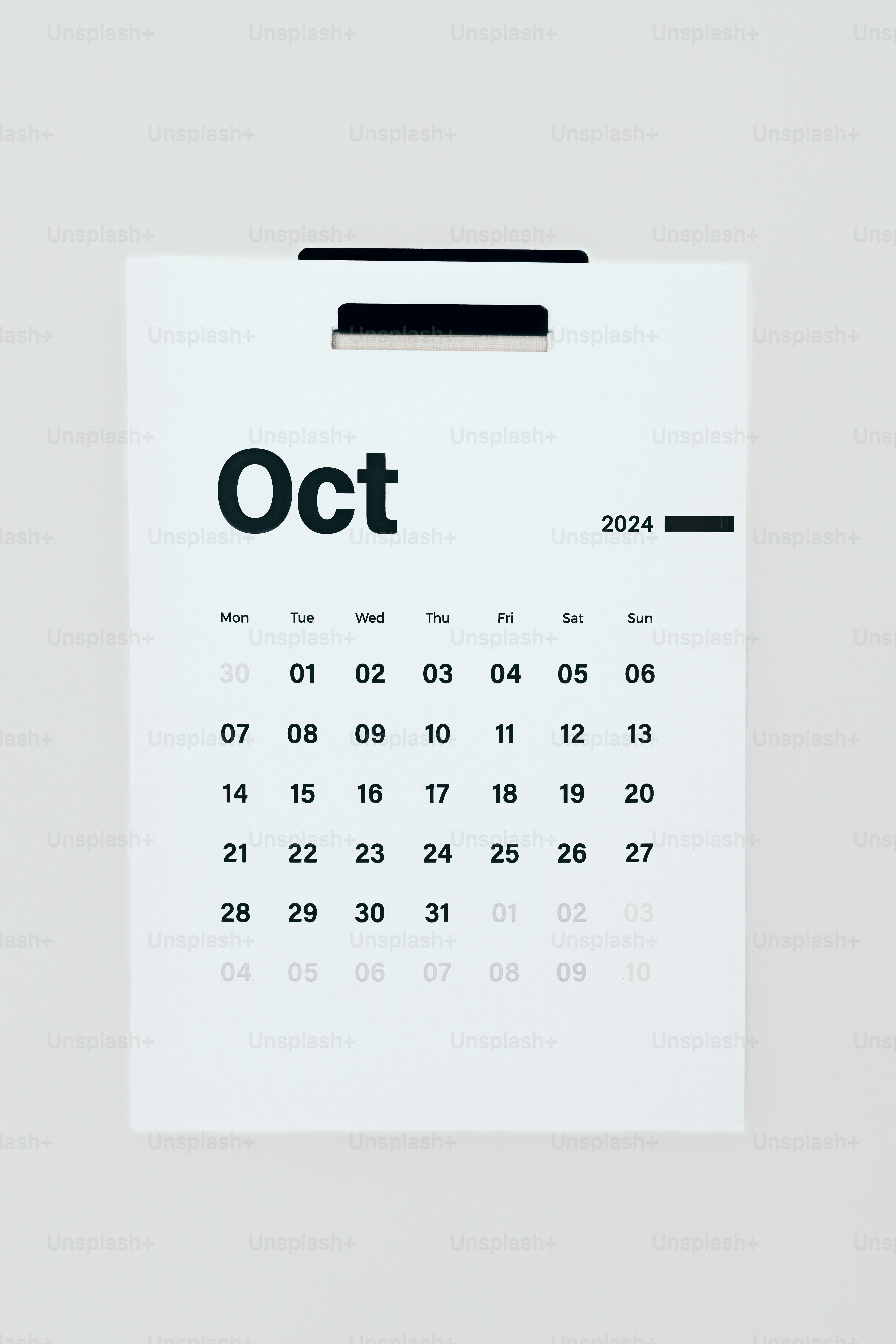 A calendar pinned to a white wall photo – October Image on Unsplash