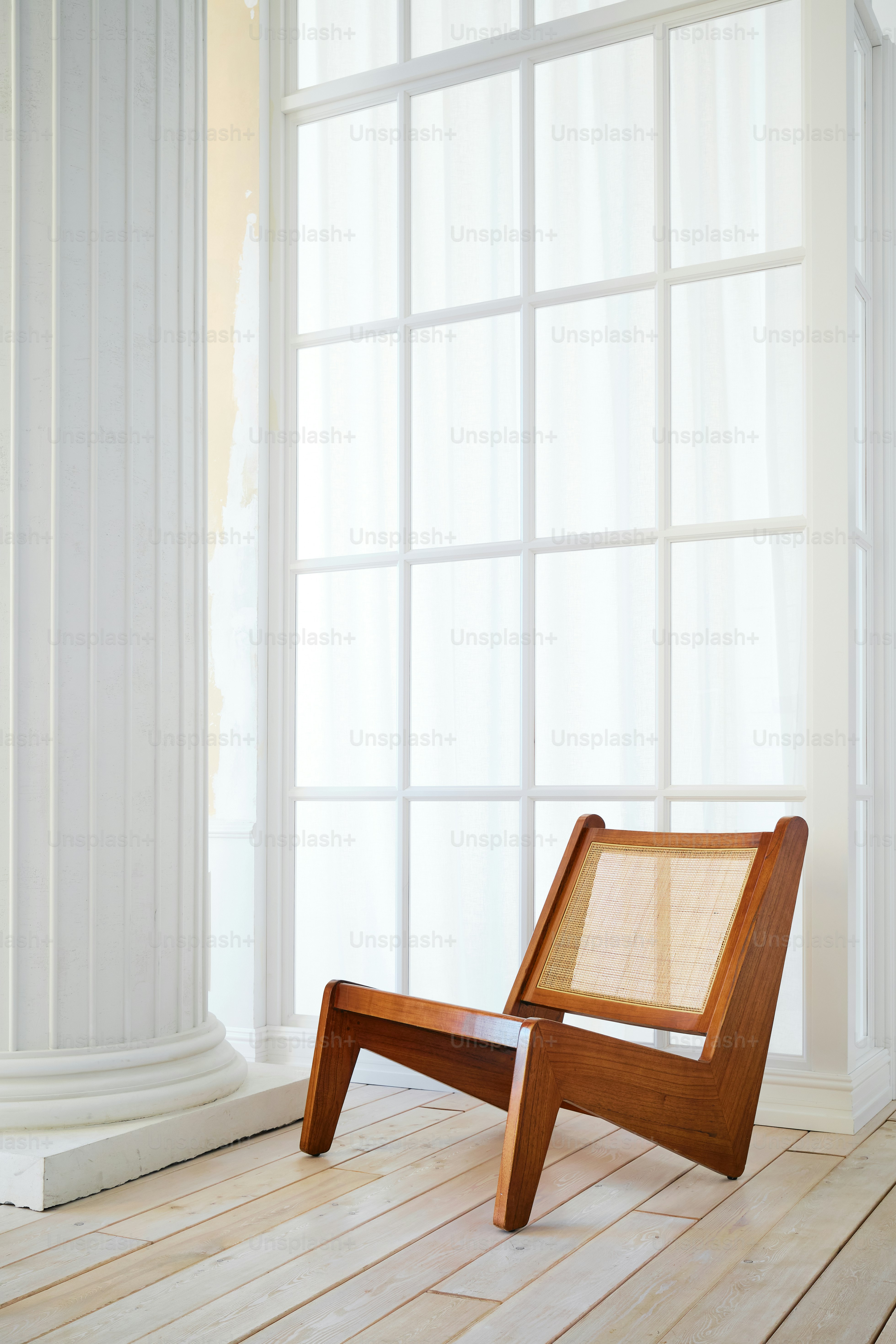 A wooden chair sitting on top of a hard wood floor photo – Window Image ...