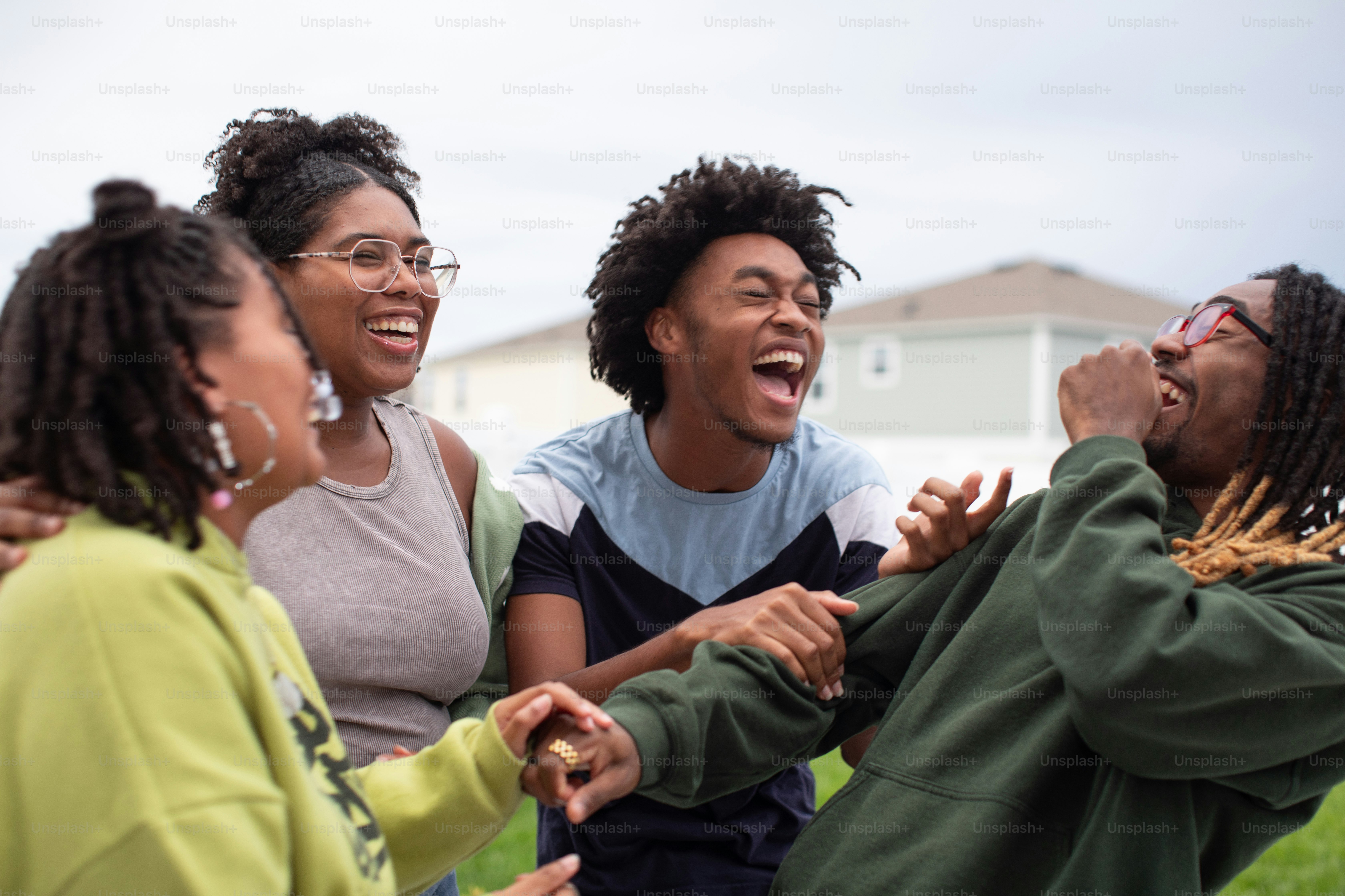 A group of people laughing and laughing together photo – Laughing Image ...